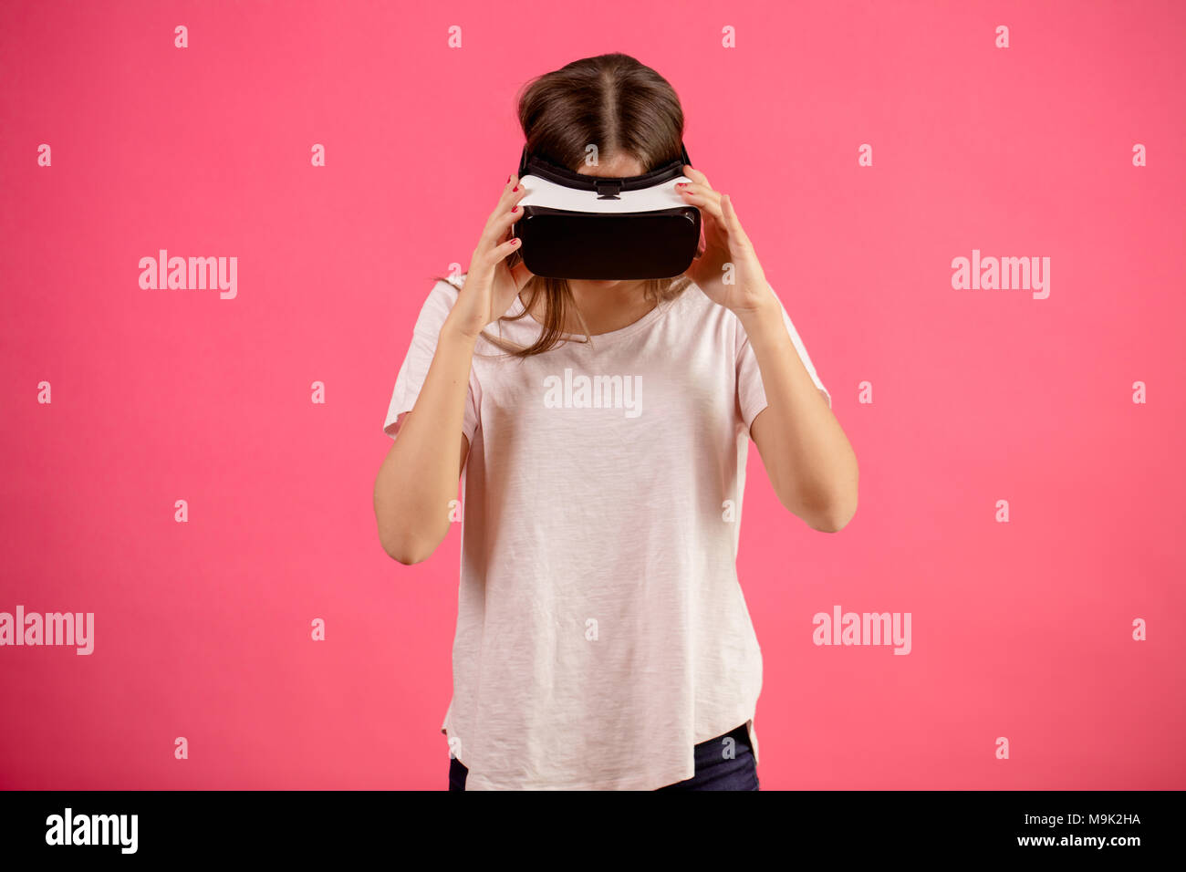 girl going over a bumb in vertual reality glasses. look down Stock ...