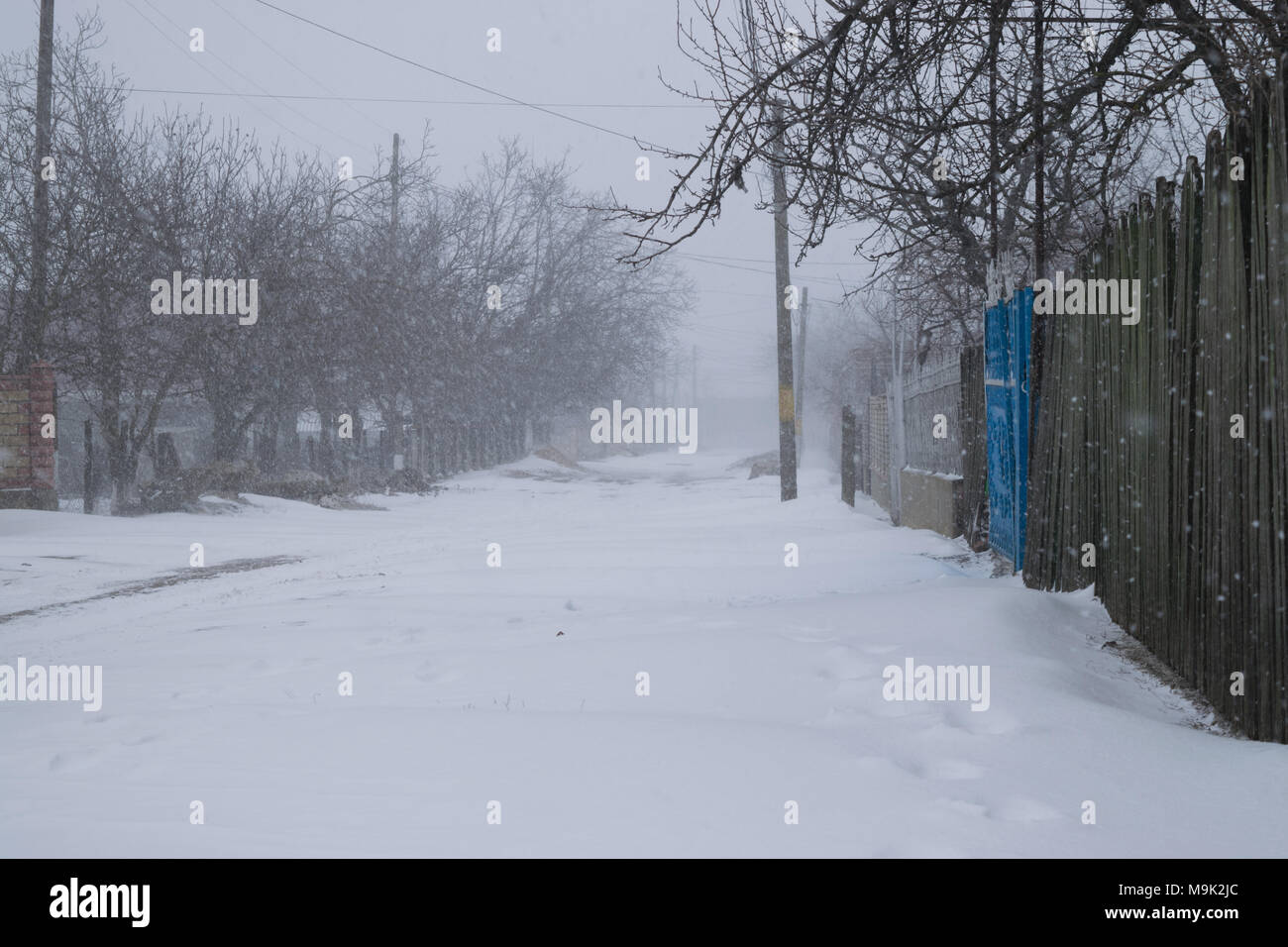 Snowy village street hi-res stock photography and images - Alamy