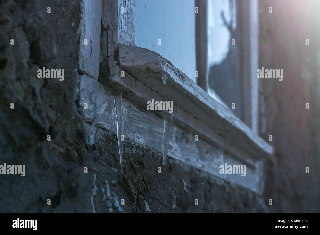 An icicle on a window during a winter morning Stock Photo - Alamy