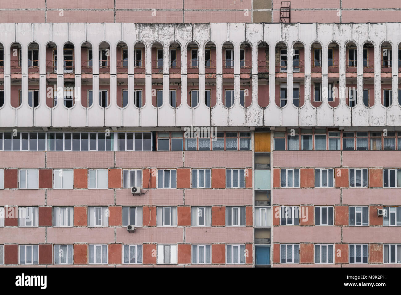 Cylinder shapes of a soviet era building in red and white brick Stock ...