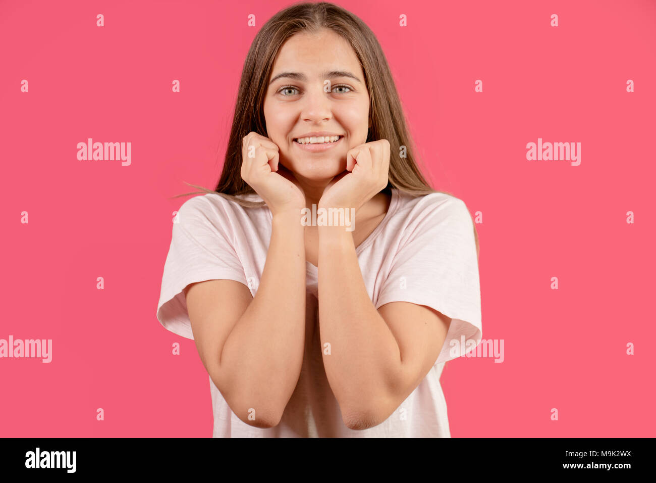 close up portrait of Happy young woman with long hair leaning on her ...