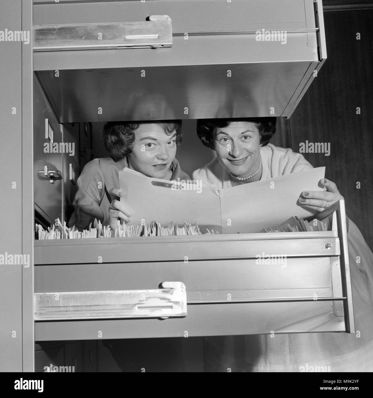 Two women office workers Black and White Stock Photos & Images - Alamy