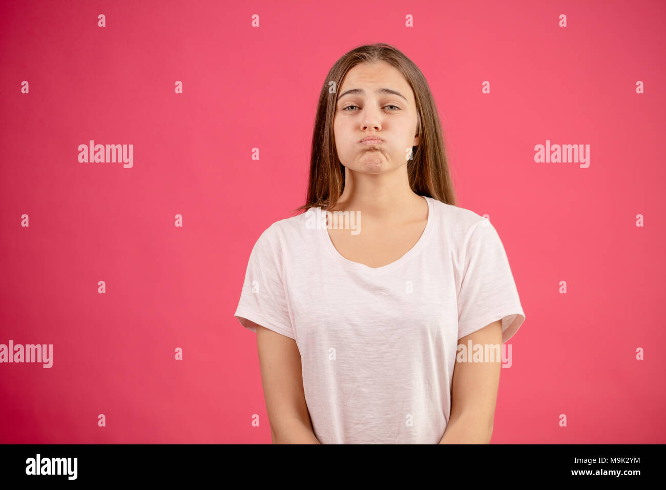 close up shot of a model with puffy cheeks. make funny face Stock Photo ...