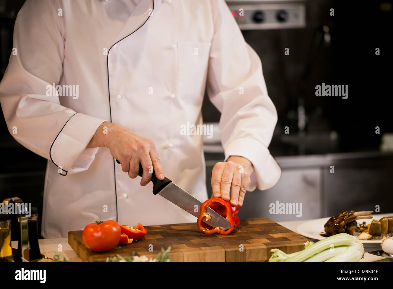 closeup photo of man making dinner from pepper. taking part in cooking ...