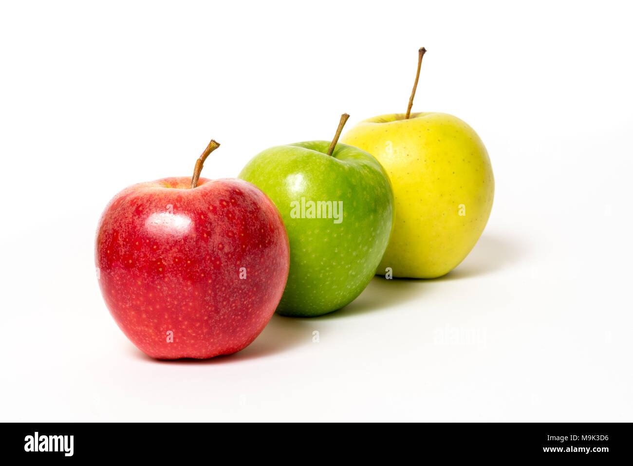 Three different coloured fresh apples isolated on white background ...