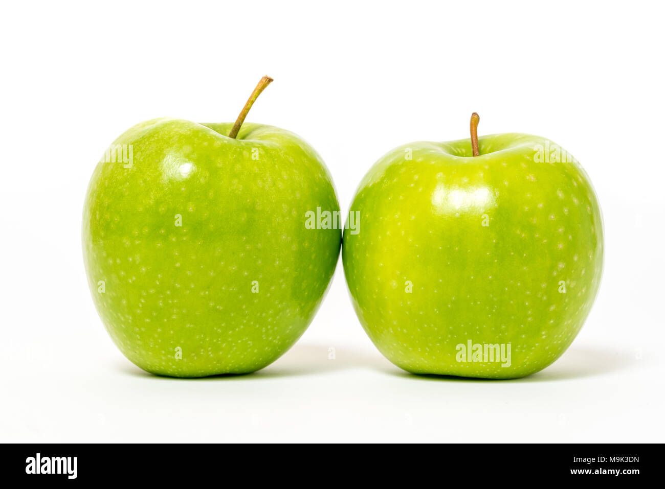 Two fresh green apples isolated on white background Stock Photo - Alamy