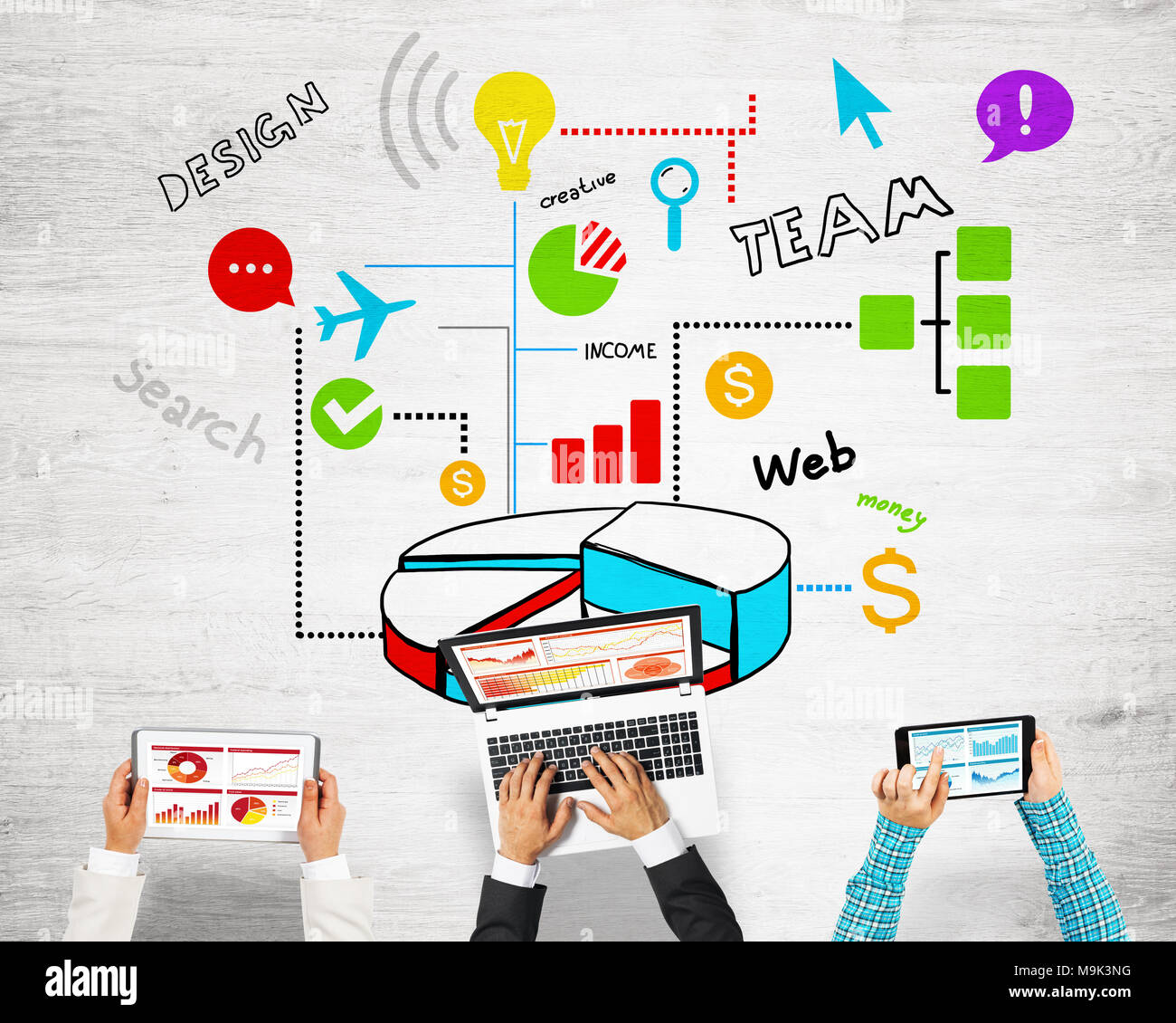 Group of three people with devices in hands working together as symbol ...