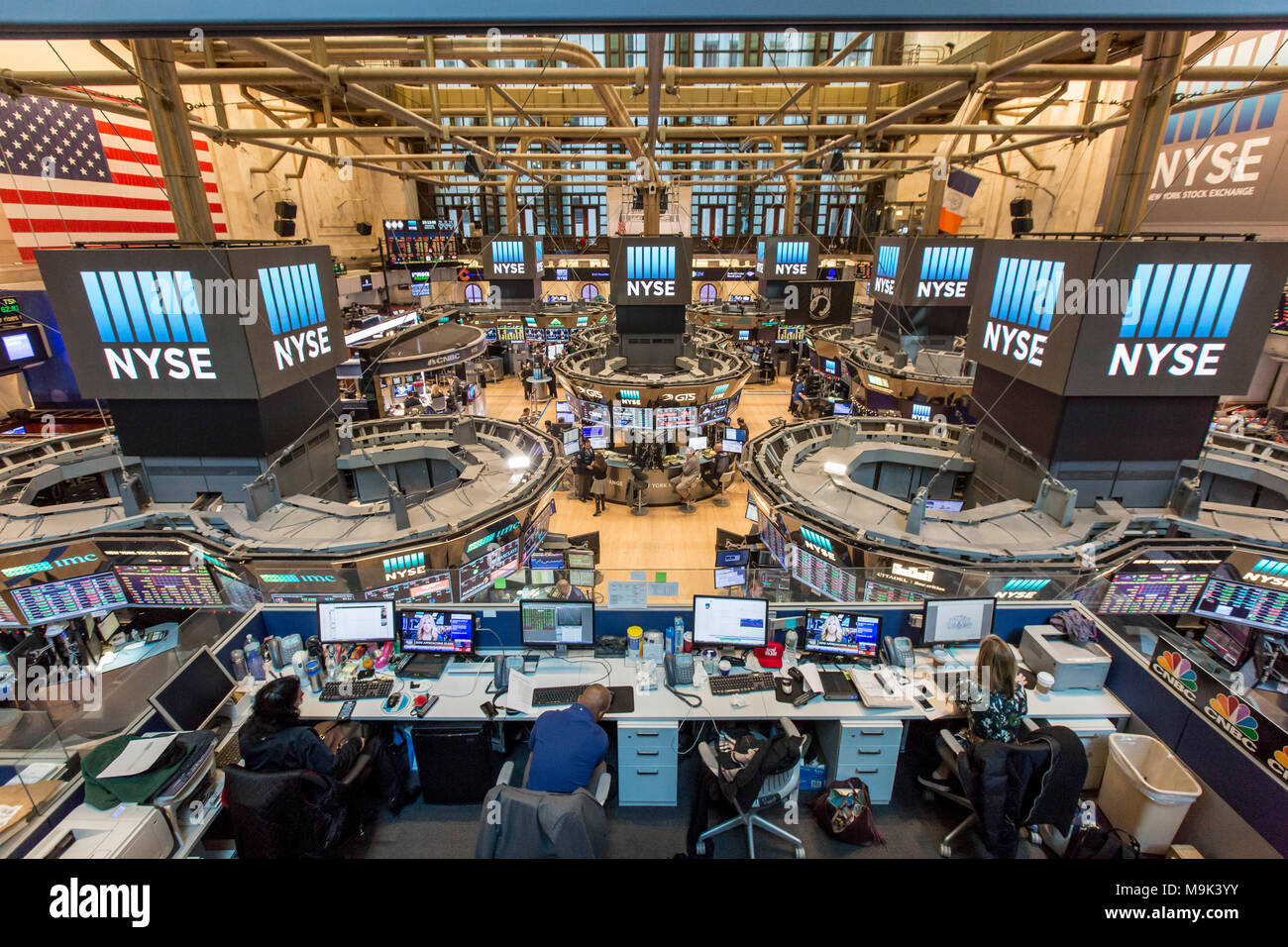 An administrative desk and a birds-eye view of the New York Stock ...