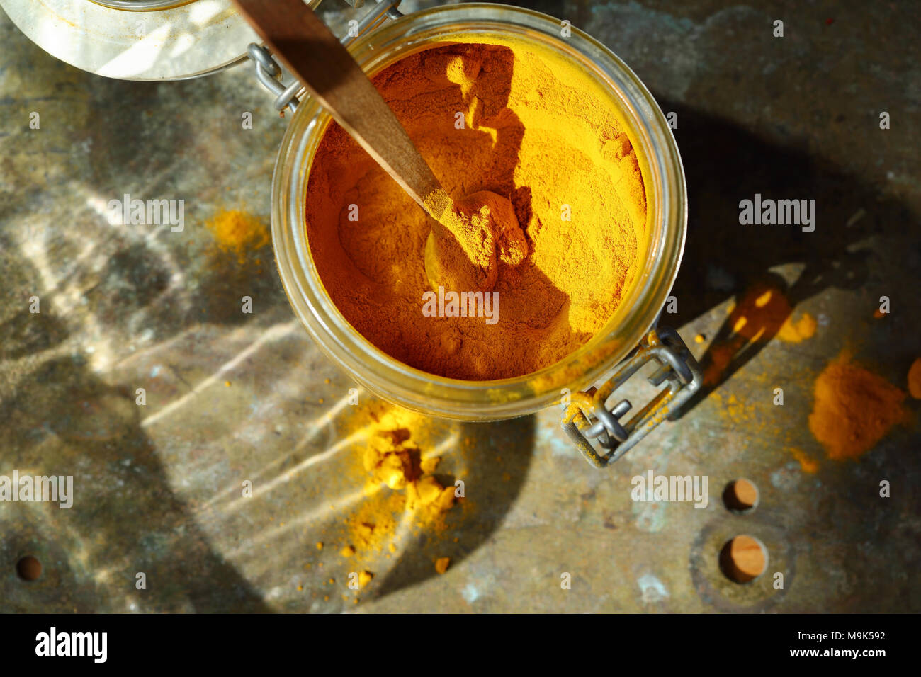 Turmeric powder in jar, spice above Stock Photo - Alamy