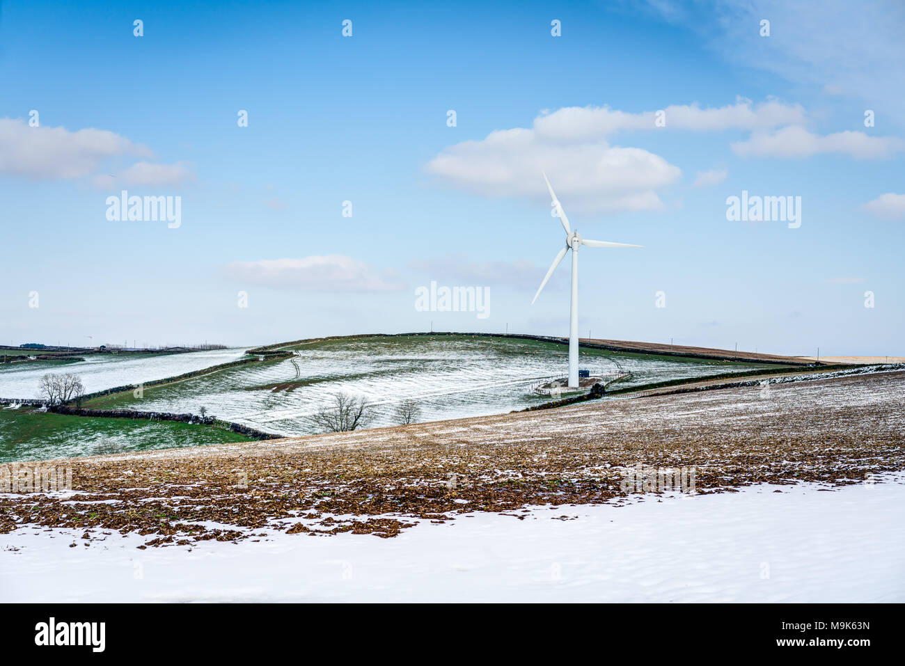 A photograph of a large wind turbine standing on Cornish farmland ...