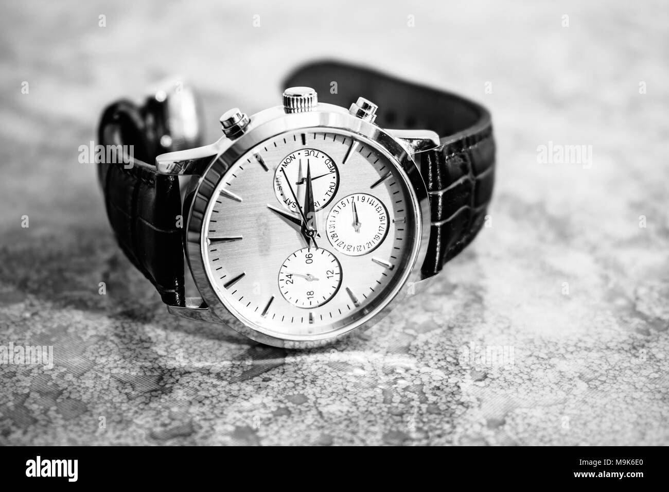 an expensive and stylish brand new silver and golden man's thin dial ...