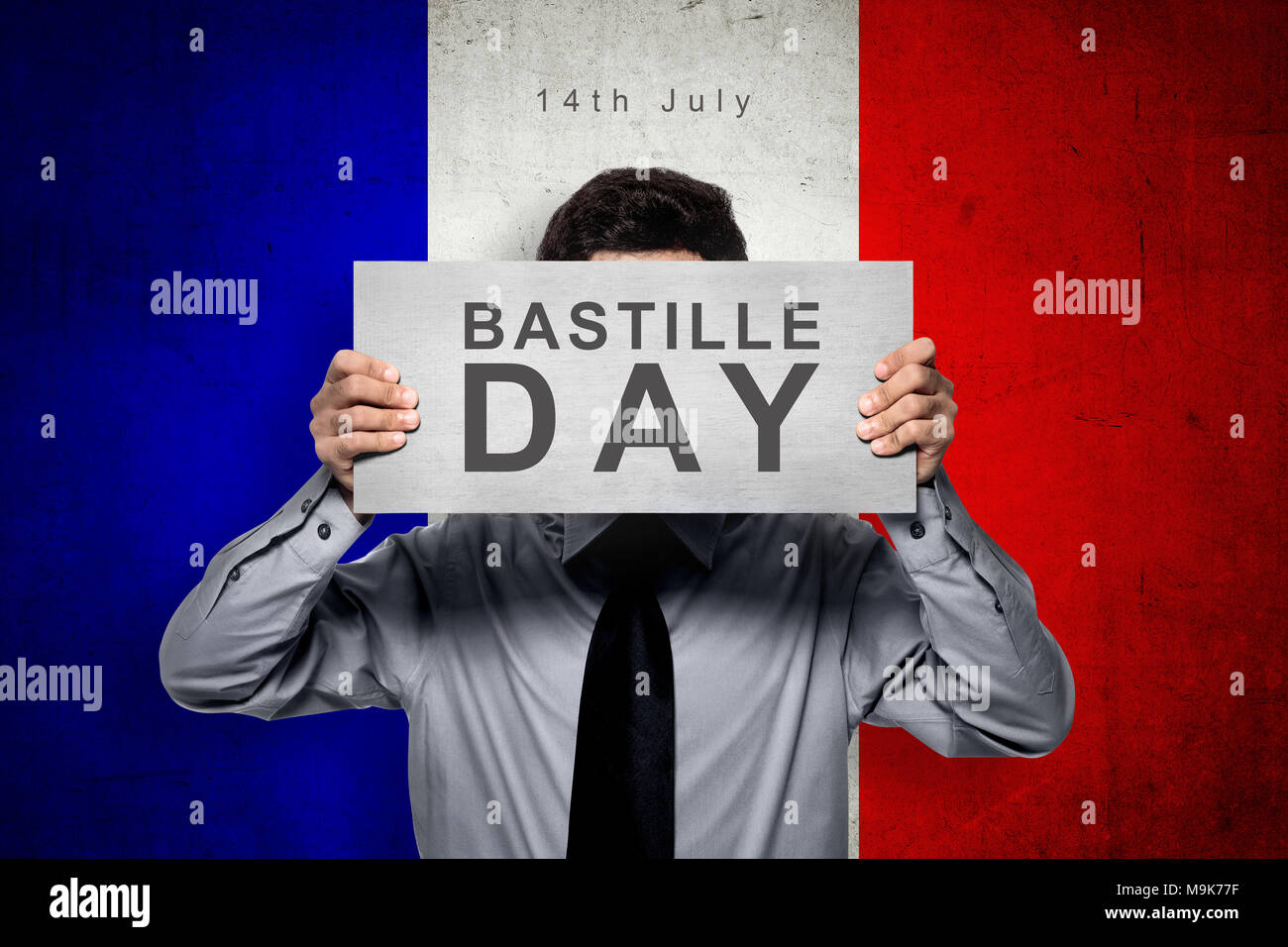 Man holding board with bastille day message over france color flag ...