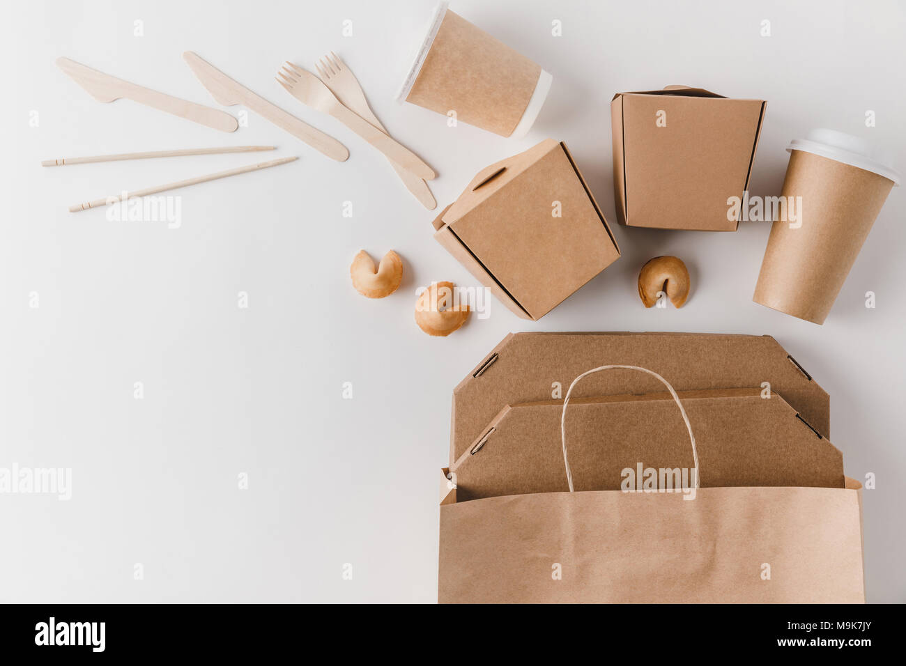 top view of junk food in take away boxes and chinese fortune cookies on ...