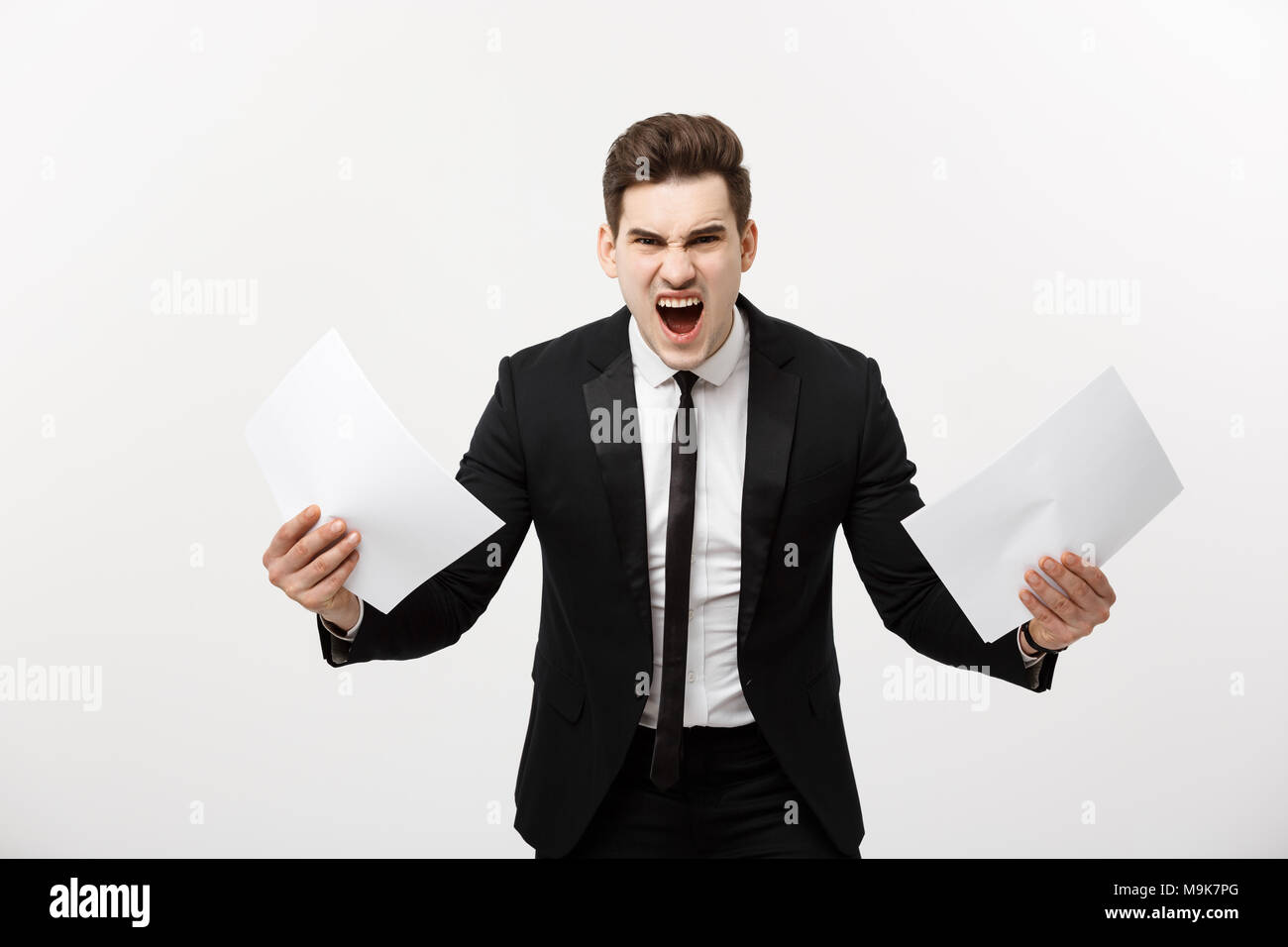 Business, people, paperwork and deadline concept - stressed handsome ...