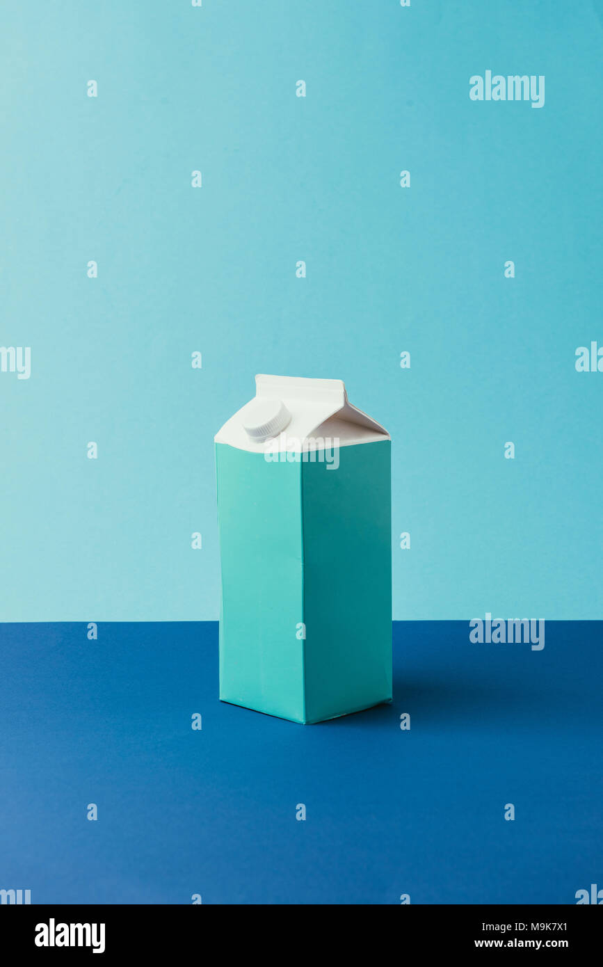 close up view of empty cardboard package on blue background, recycle ...