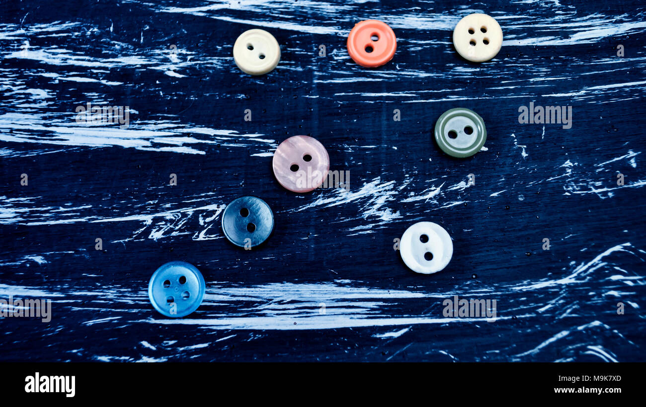 Buttons for clothing and sewing on the table Stock Photo - Alamy