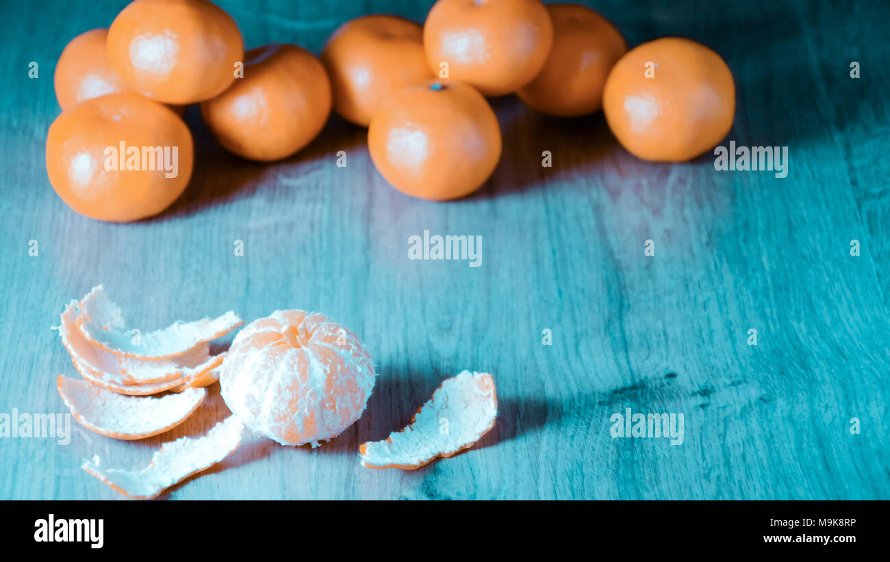 A composition of fresh mandarins on the table in the afternoon Stock ...
