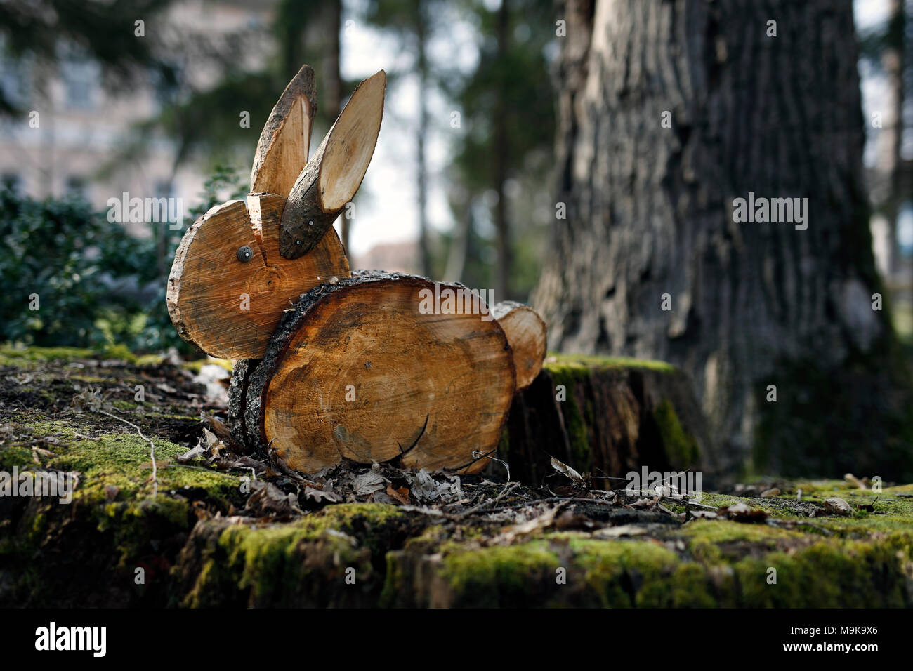 Hand made wooden rabbit. Creative and unique figure placed in the city ...