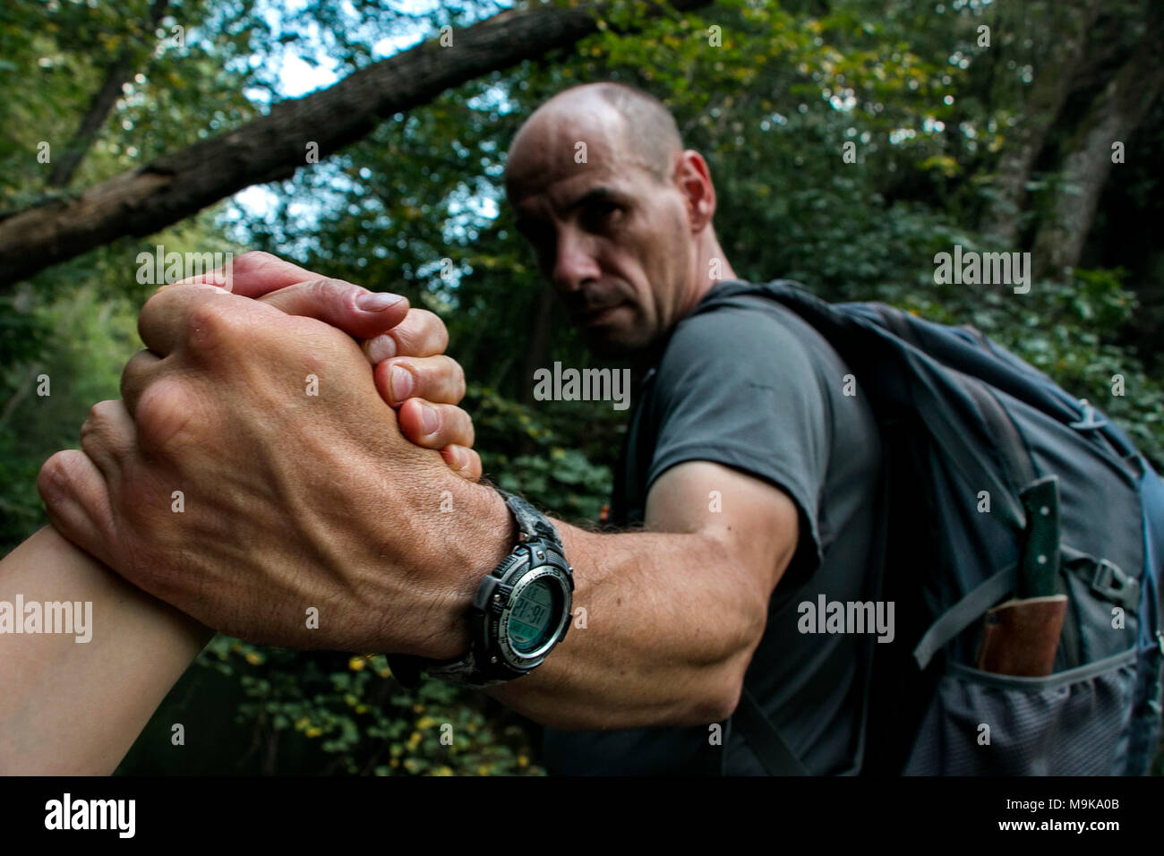 Man giving man helping hand hi-res stock photography and images - Alamy