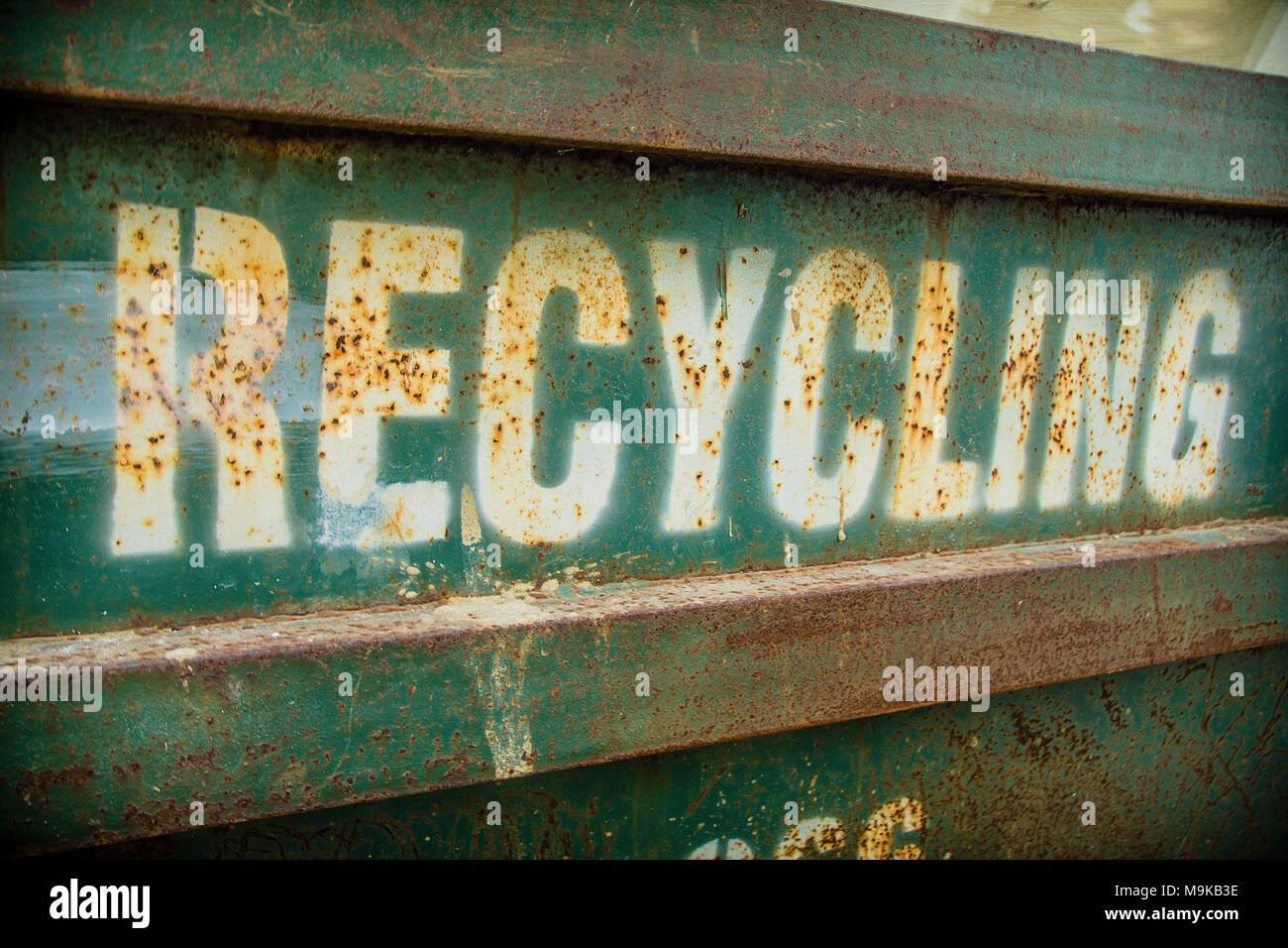 Recycled sign on weathered background Stock Photo - Alamy