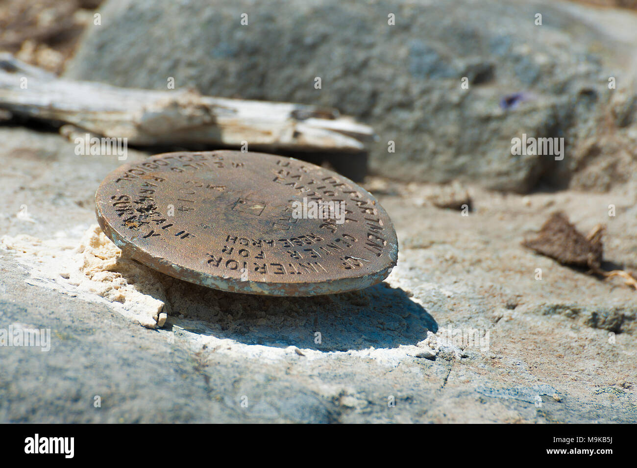 A brass disk benchmark is located at the top of Castle Peak. The center ...