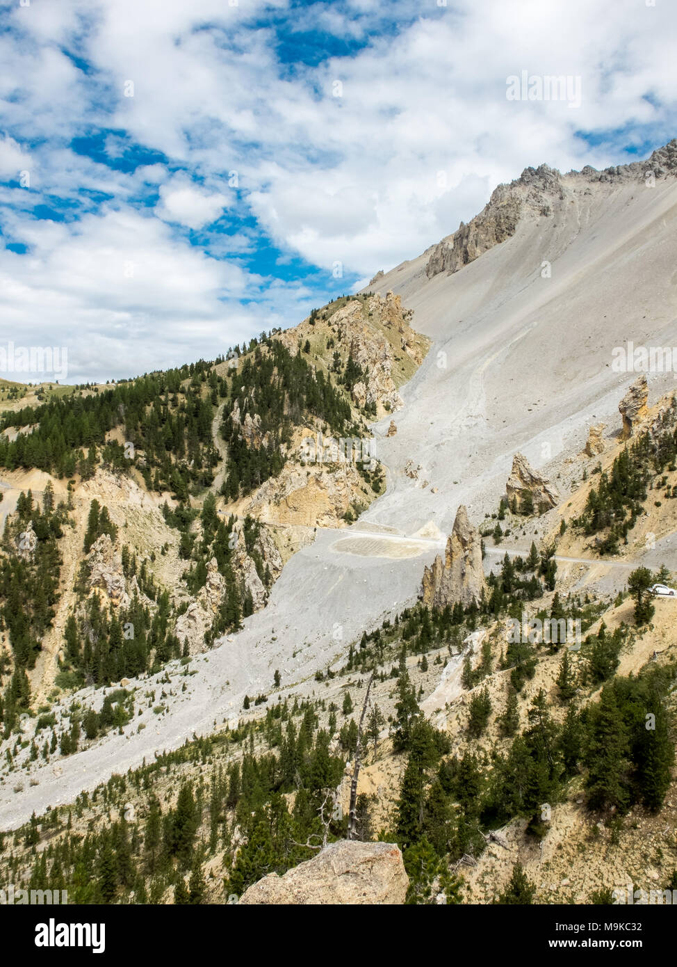 View of Casse Deserte, rocky sandy zone around the road climbing to Col ...