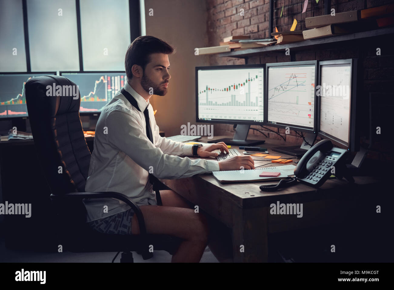 Concentrated businessman or stock broker over forex chart projection ...