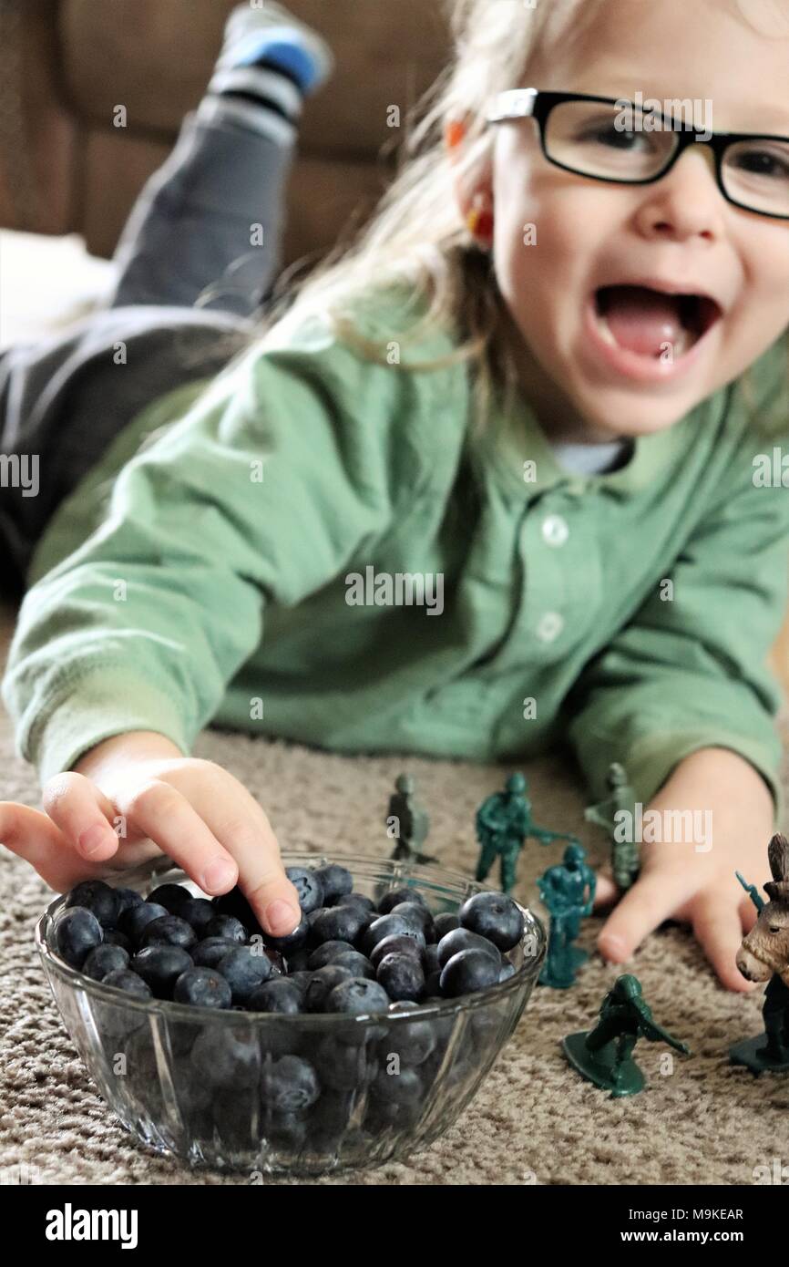 Blueberry snack while play Stock Photo - Alamy