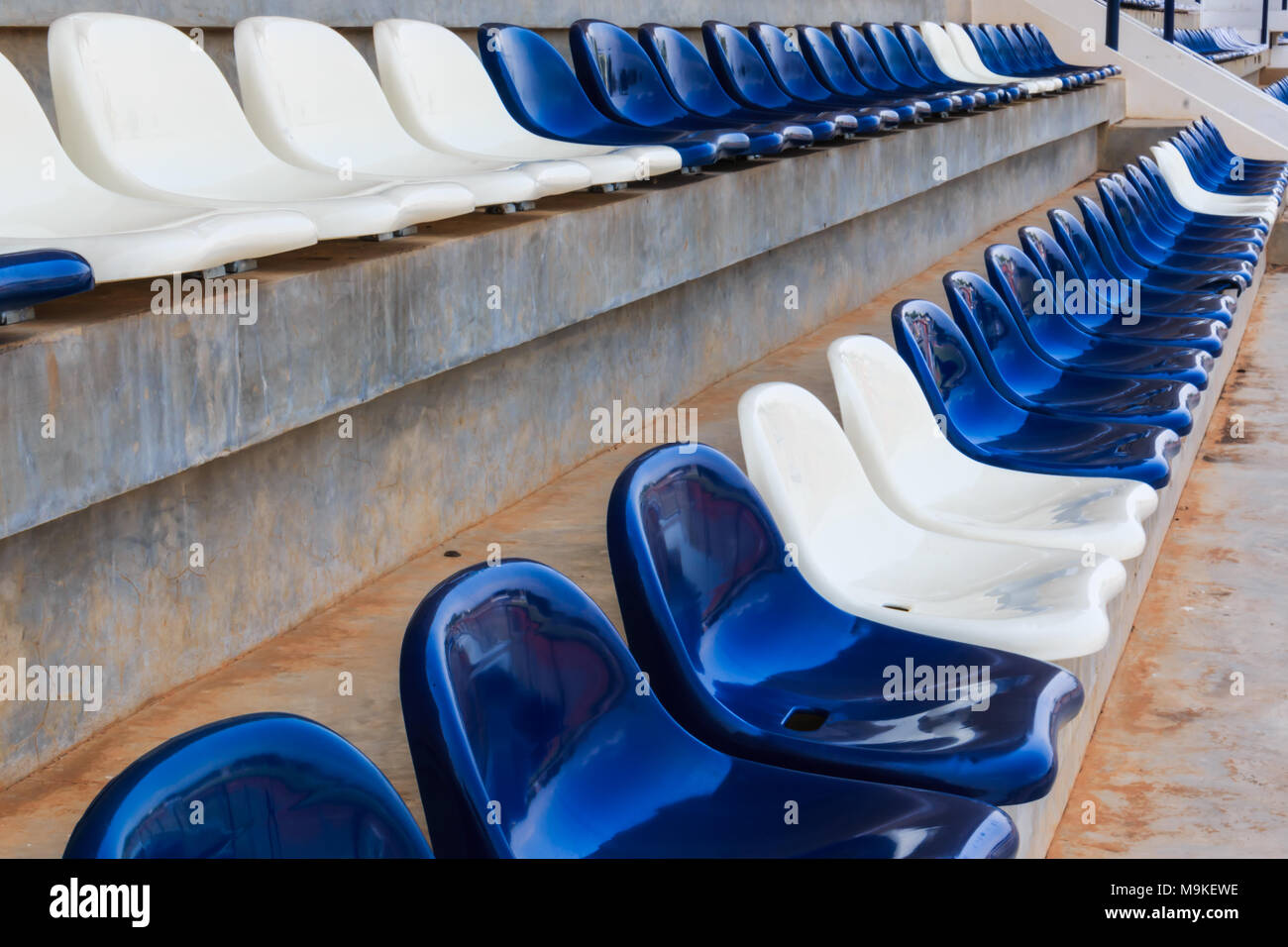 Row of Grandstand chairs in stadium Stock Photo - Alamy