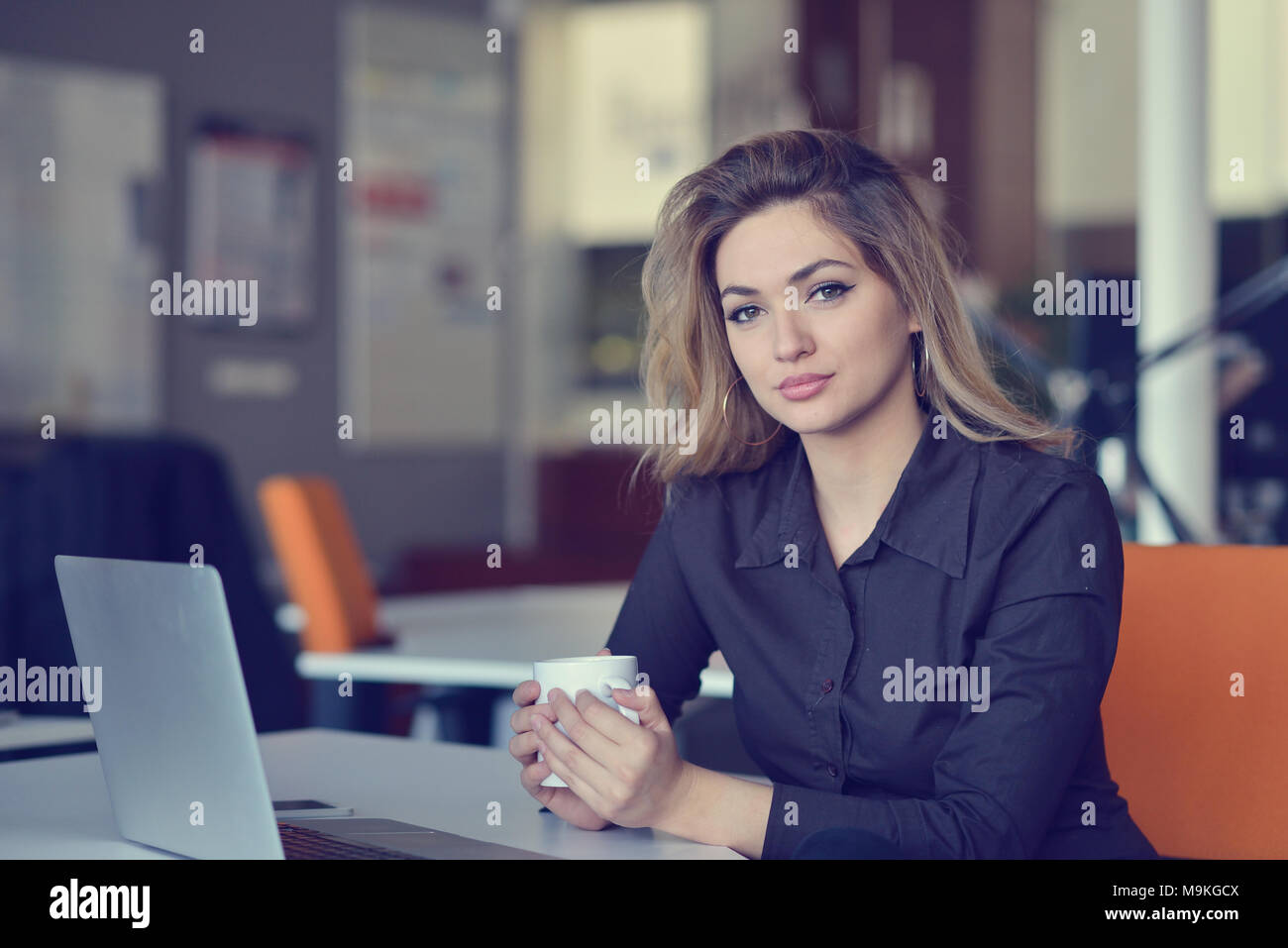 Portrait of cheerful employer of business enterprise enjoying creative ...