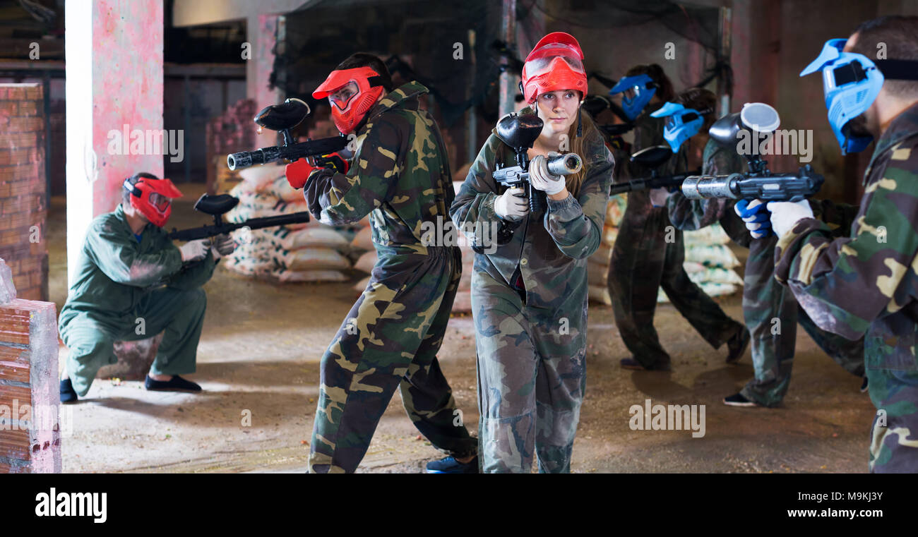 Red team of young people are ready for battle in paintball club Stock ...