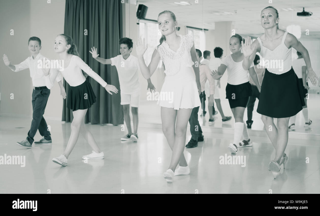 positive children learn dance movements in dance class Stock Photo - Alamy