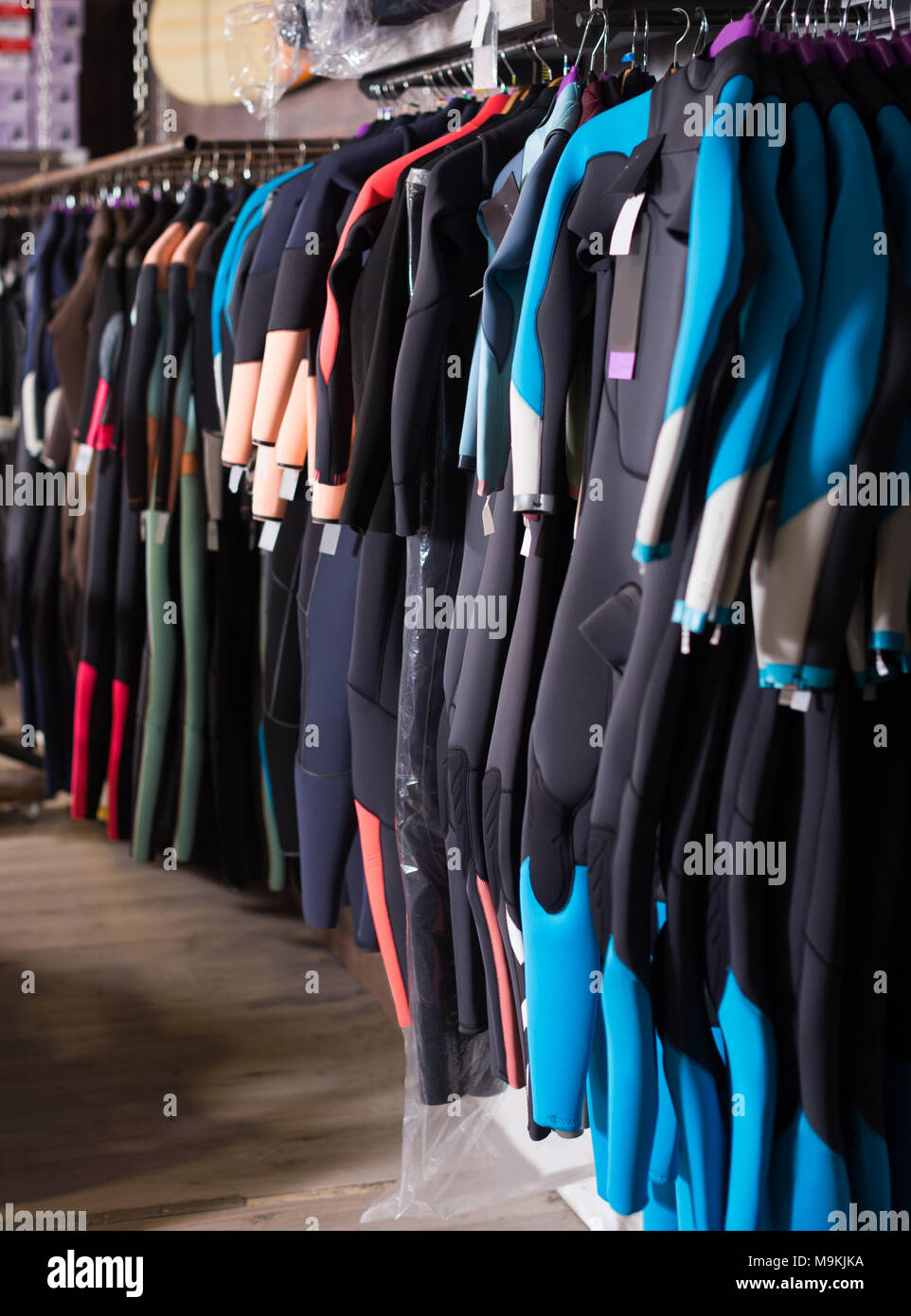 Image of colorful wetsuit hanging in the modern australian store for ...