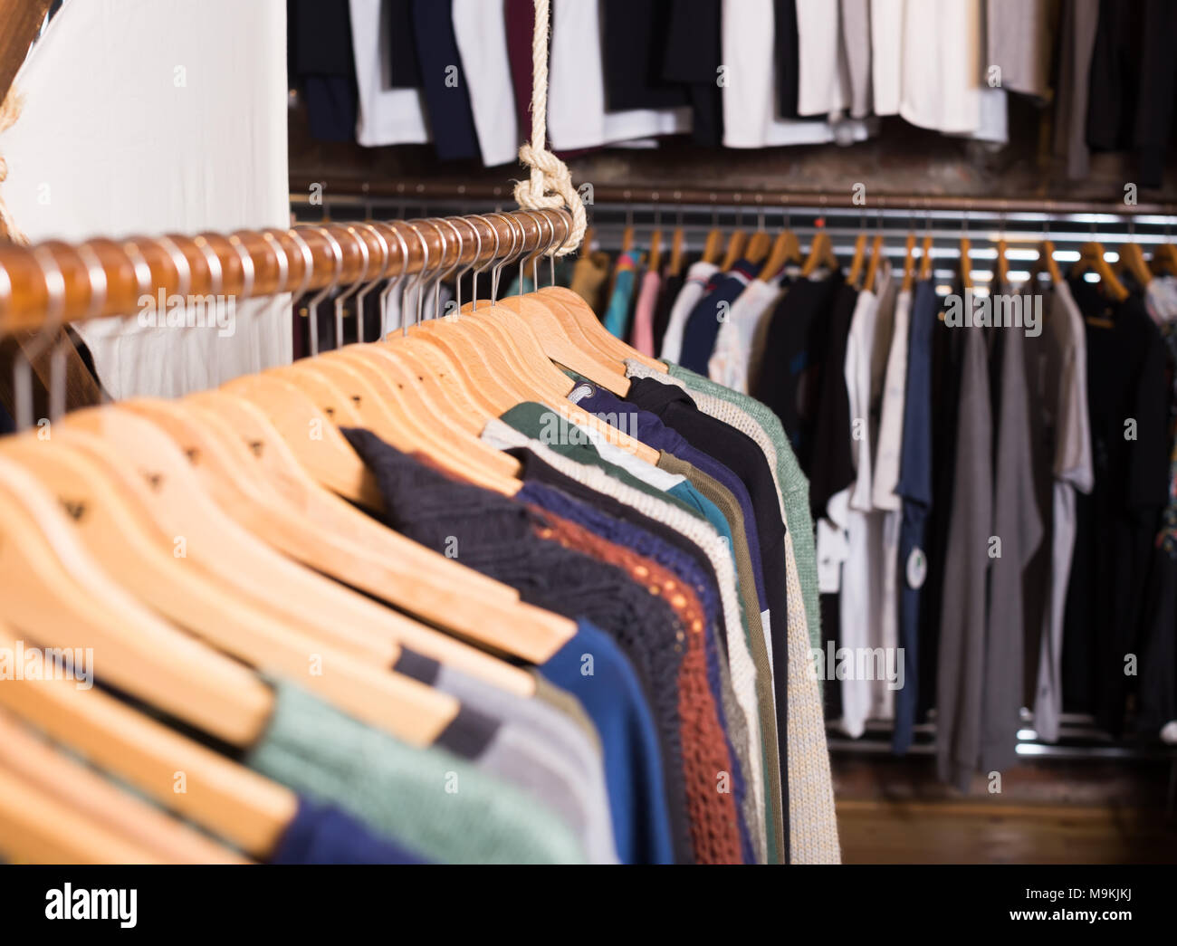 image of different colored clothes in the modern shopping centre Stock ...