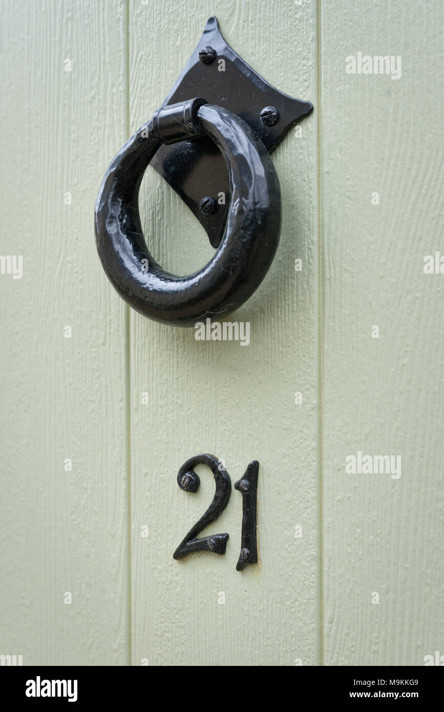 The number twenty one door knocker made with black, wrought iron ...