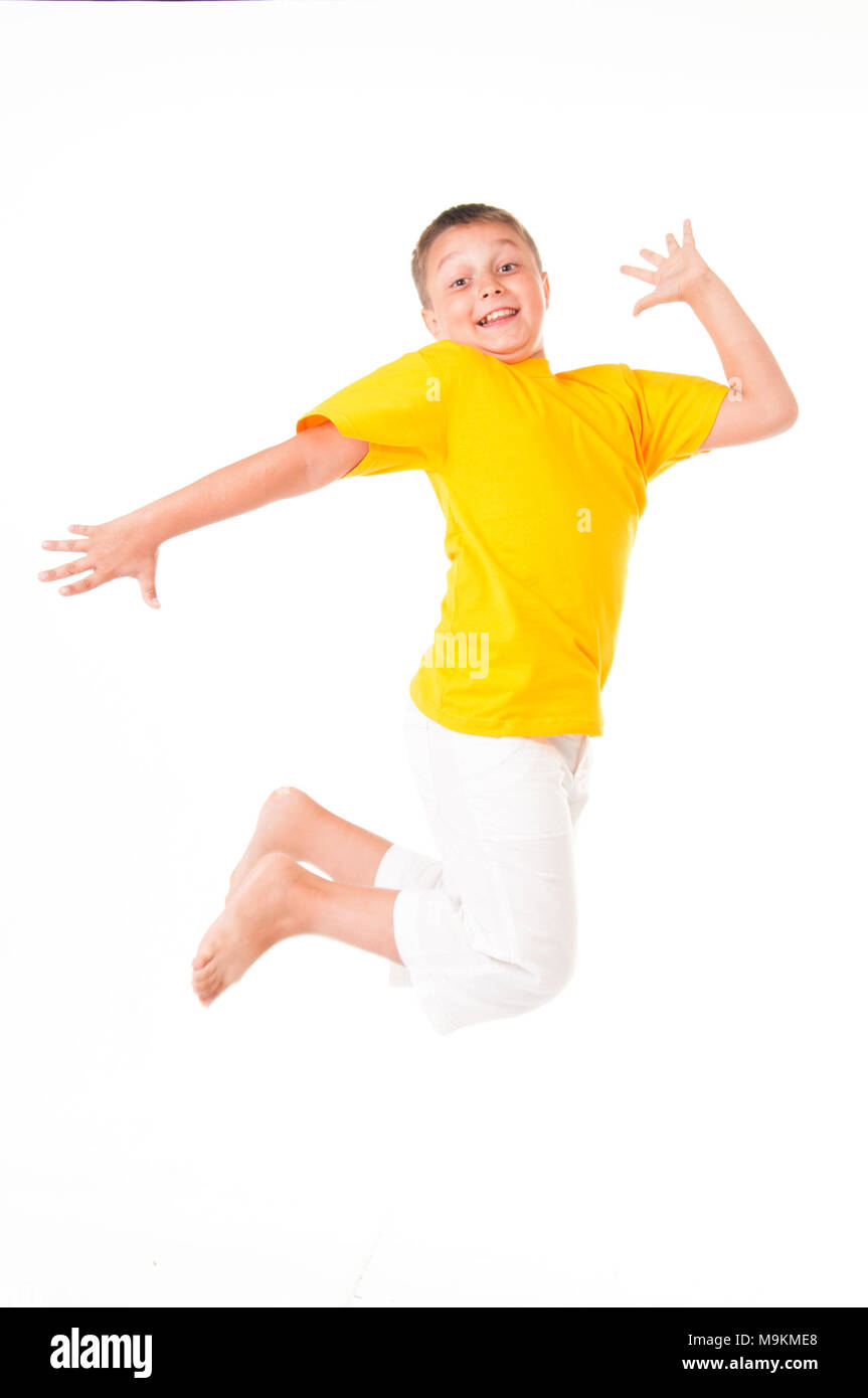 Happy little boy jumping isolated on white background Stock Photo - Alamy