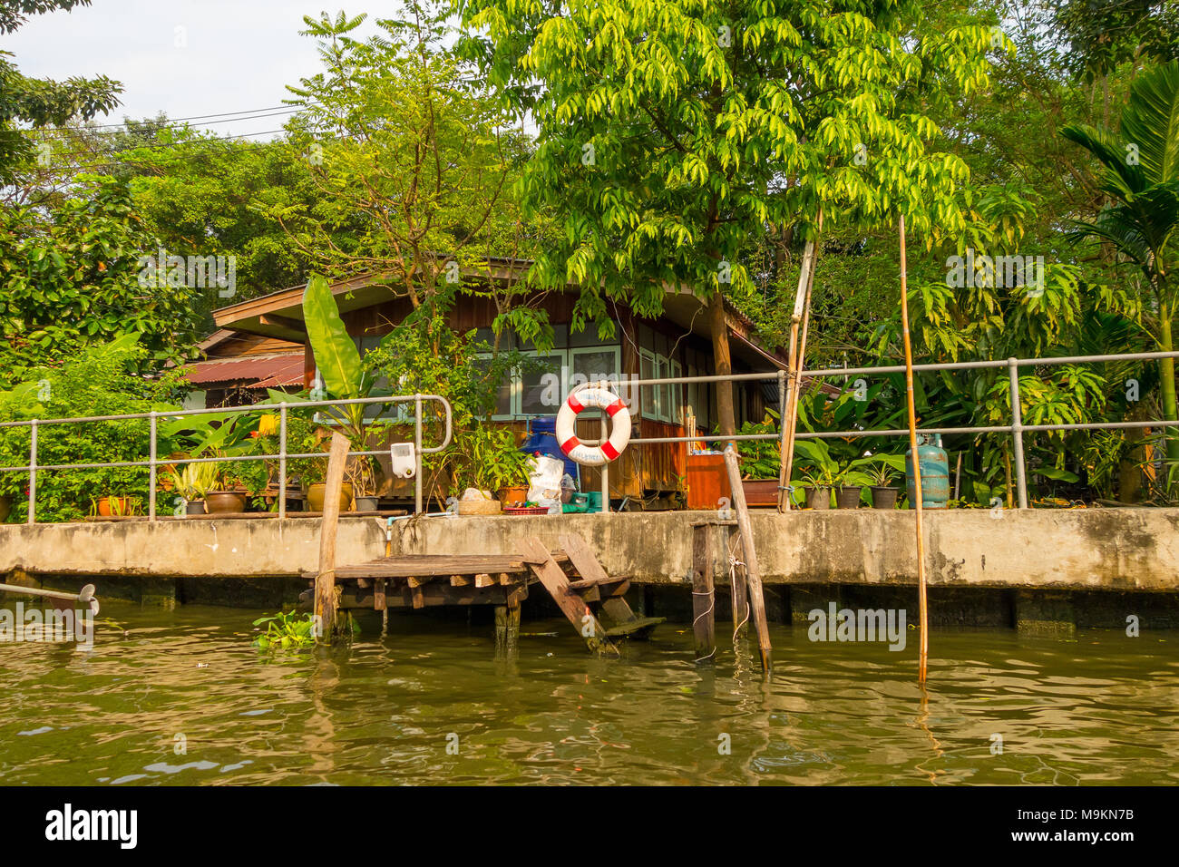 Outdoor view of floating poor house with two falgs at the enter of the ...