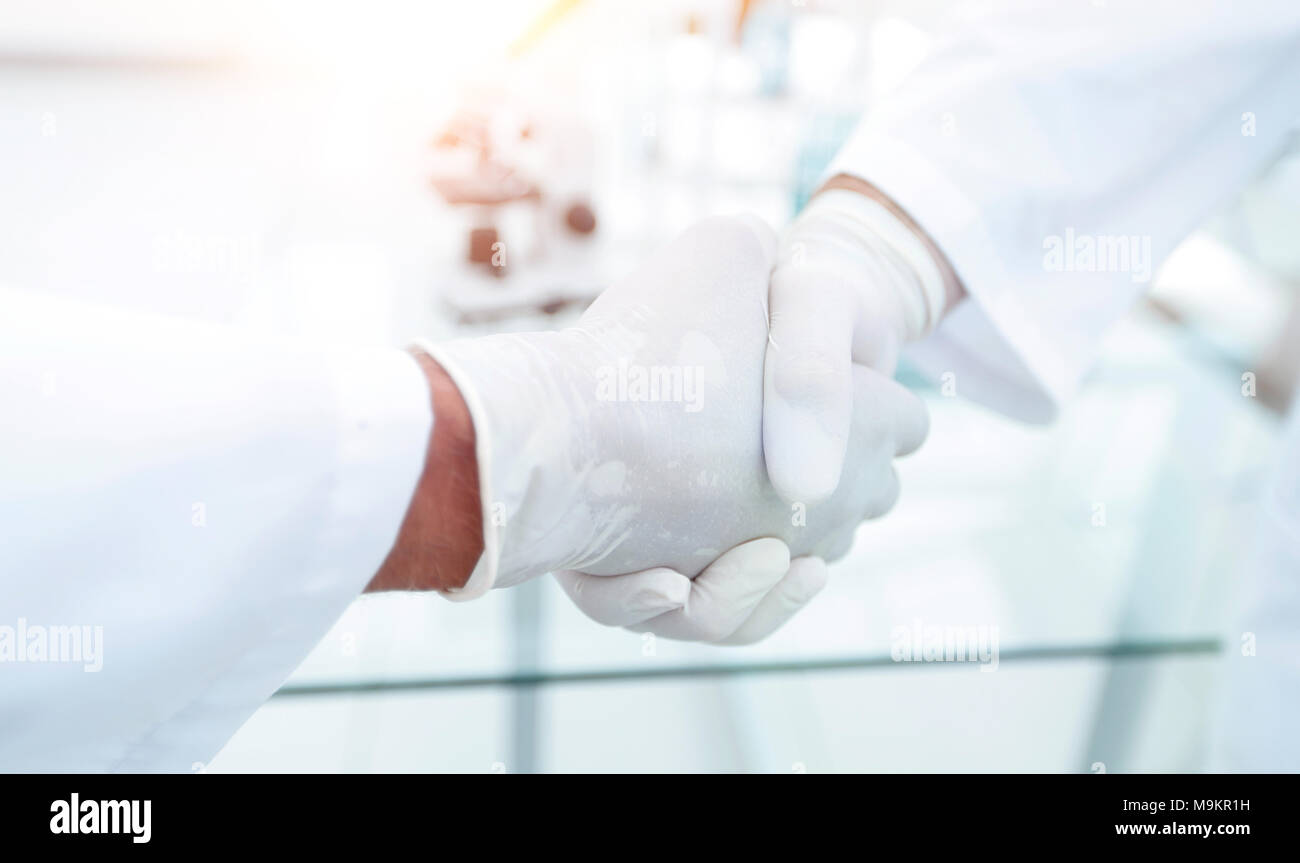 Surgical gloves handshake hi-res stock photography and images - Alamy