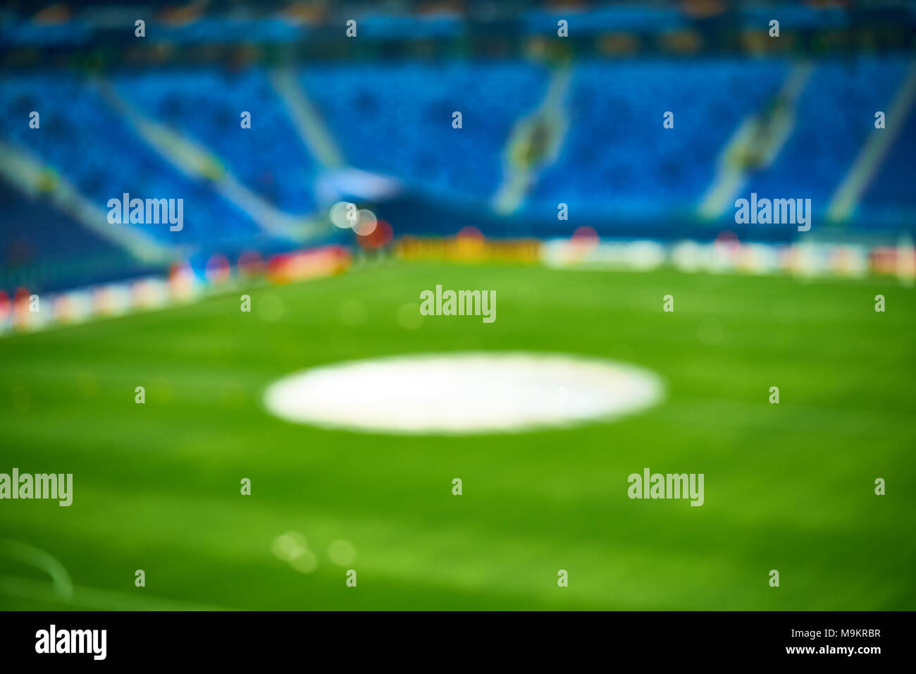 Empty blue green football soccer field stadium. Soft focus blurred ...