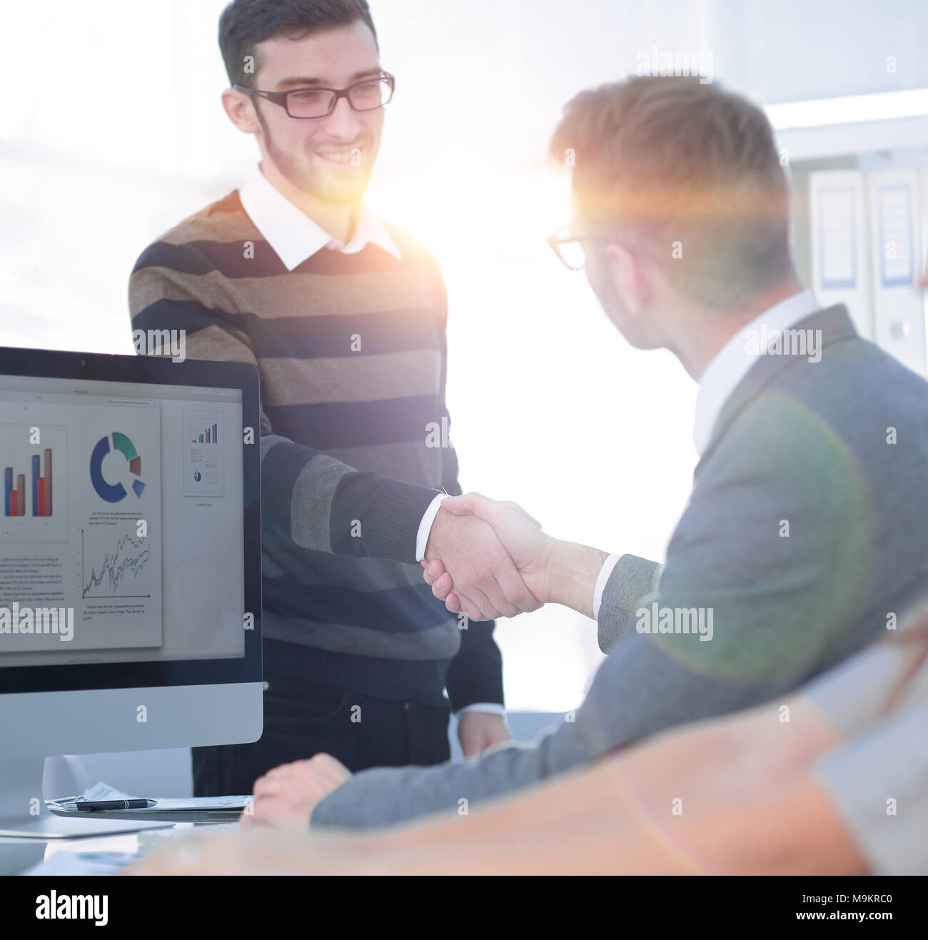handshake Manager and the client Stock Photo - Alamy