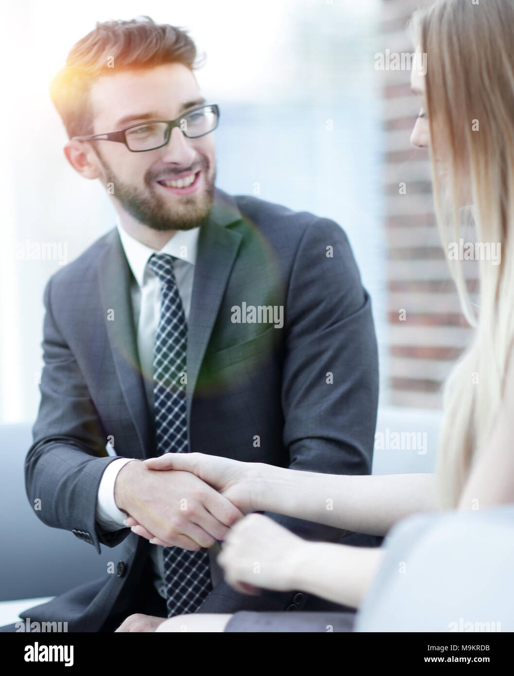 Confident woman shakes hands hi-res stock photography and images - Alamy