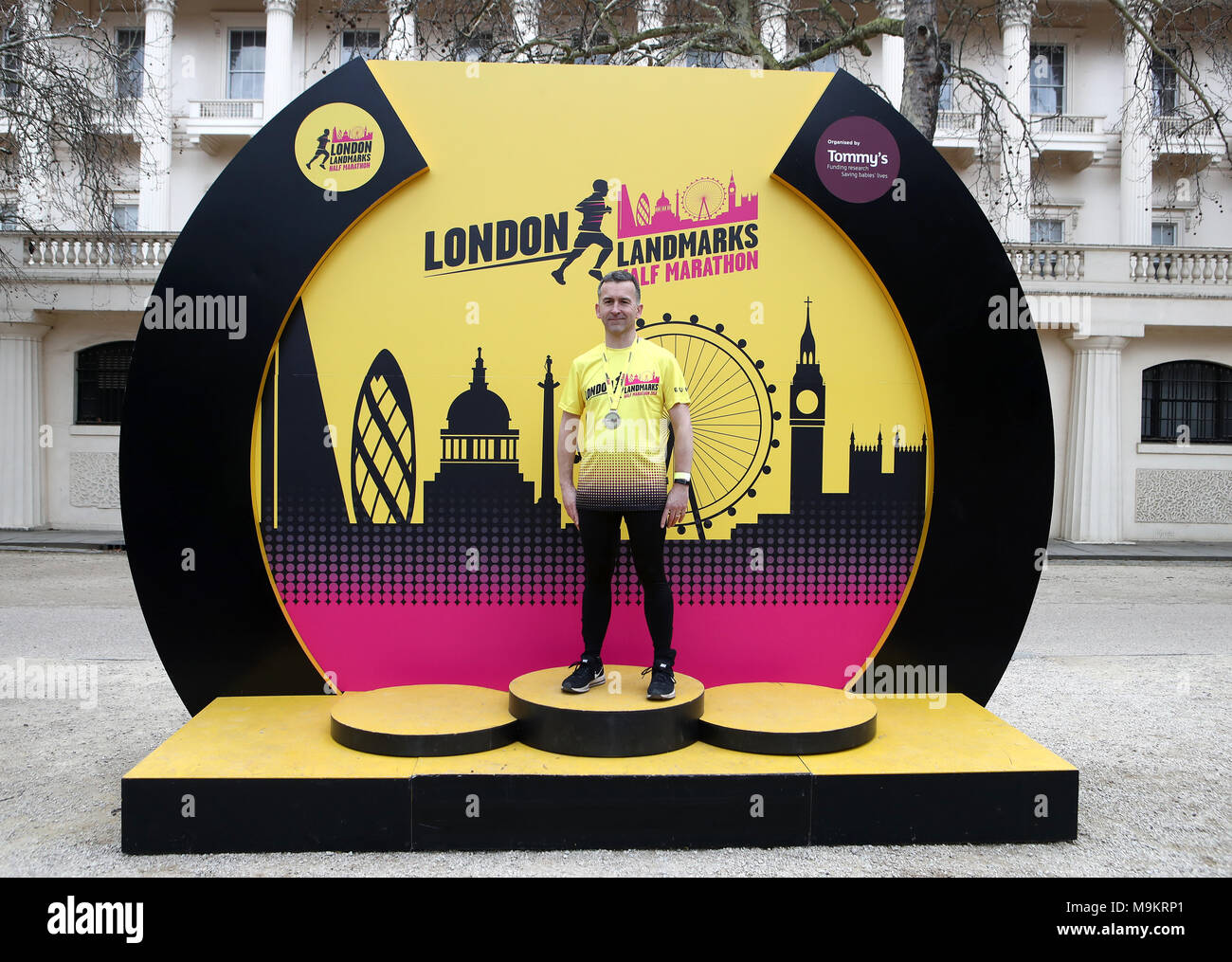 Finishers pose on a podium after the 2018 London Landmarks Half ...