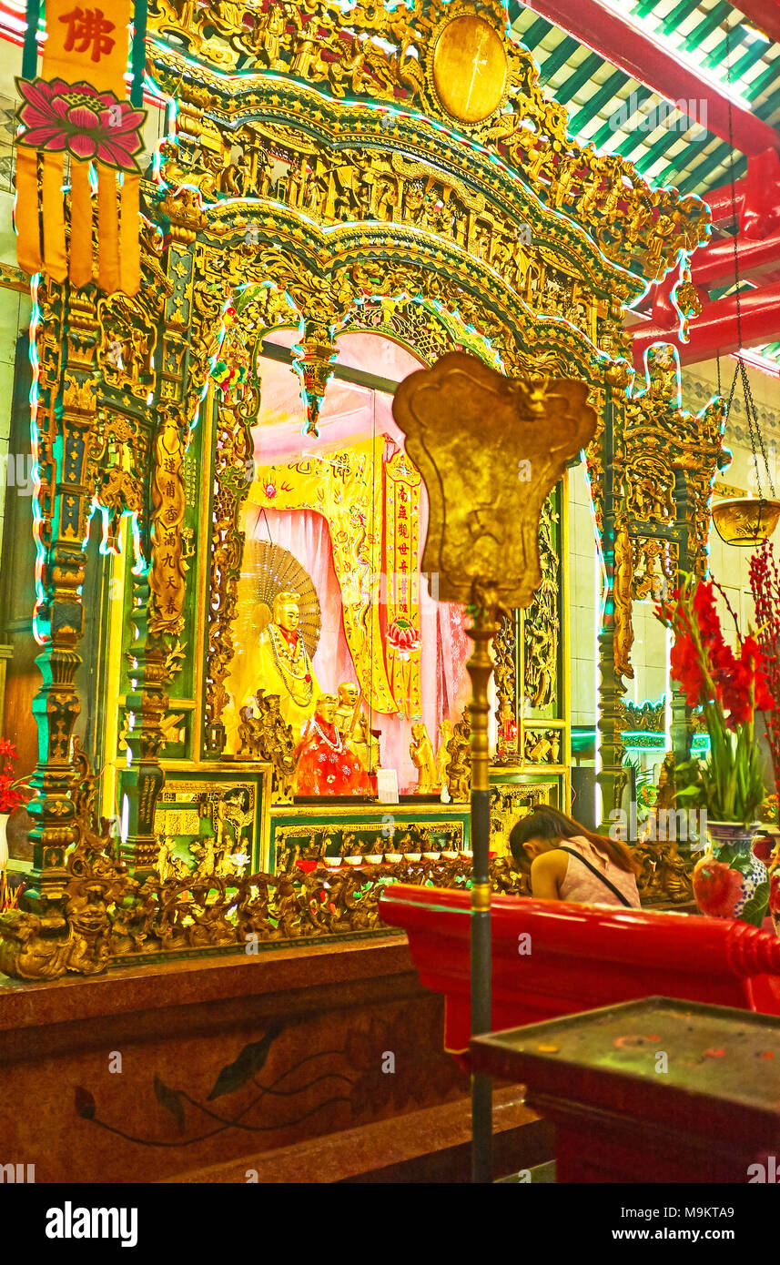 YANGON, MYANMAR - FEBRUARY 14, 2018: The richly decorated altar of ...