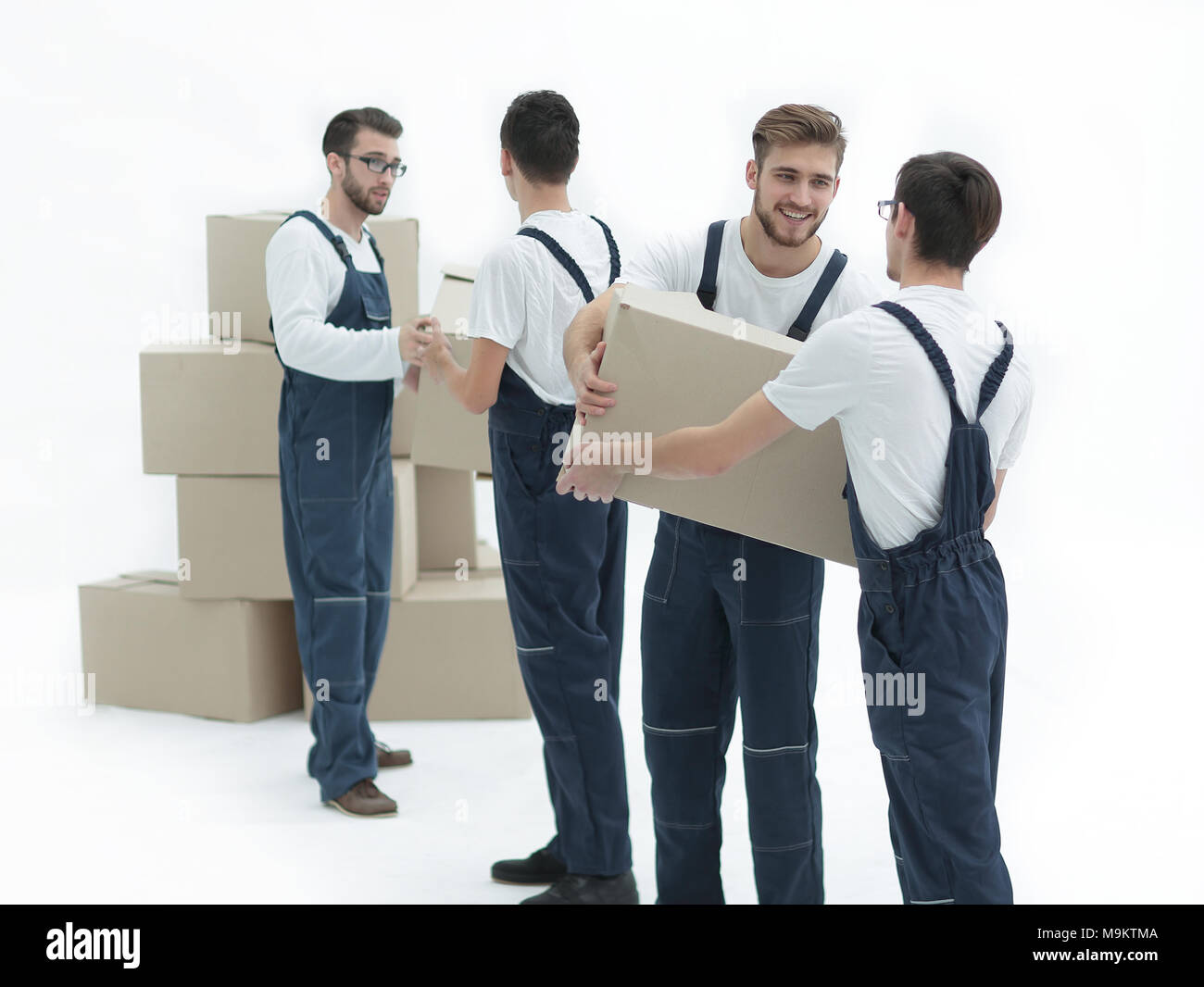 Workers moving it together hi-res stock photography and images - Alamy