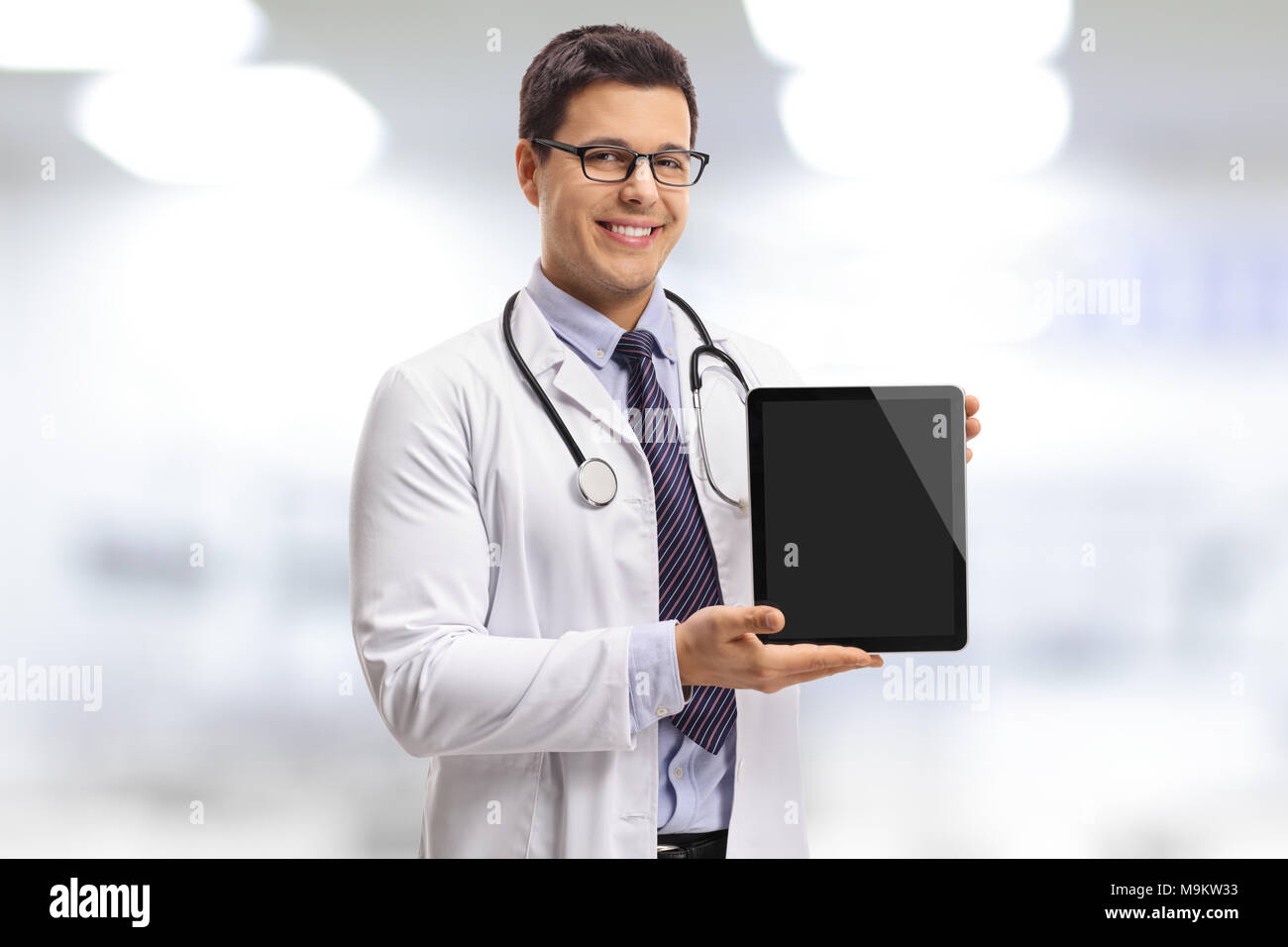 Doctor holding tablet showing medical hi-res stock photography and ...