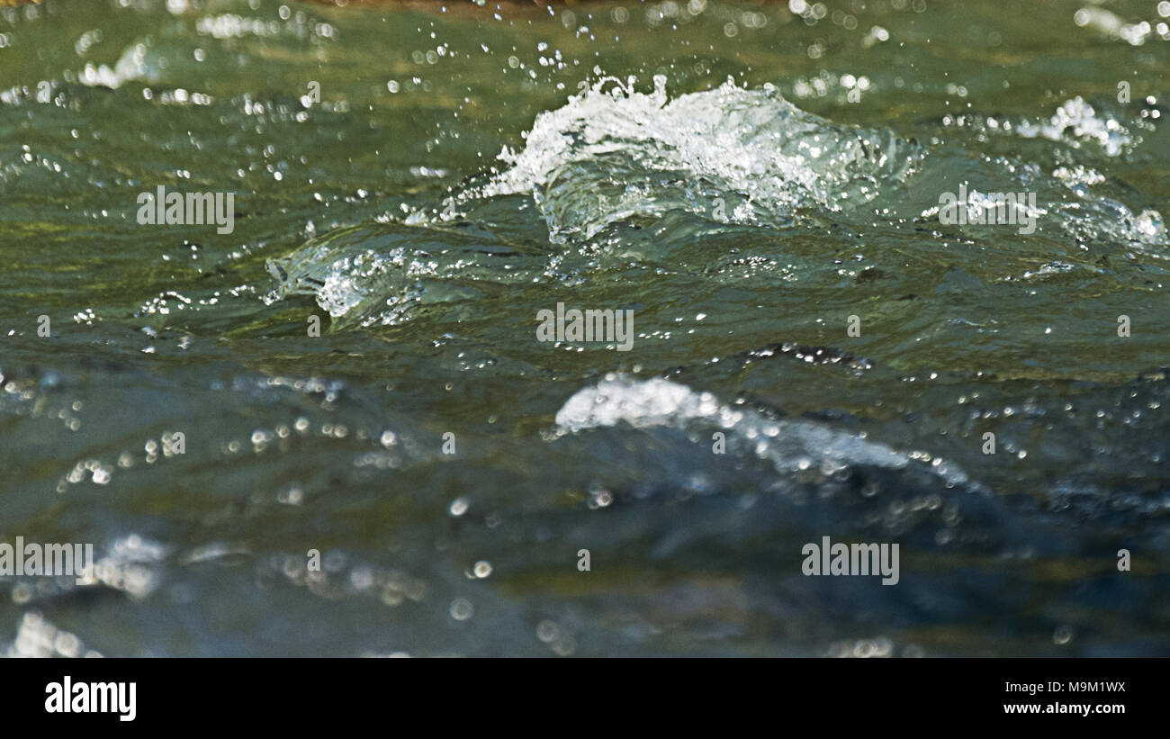 Fast flowing stream over rocks hi-res stock photography and images - Alamy