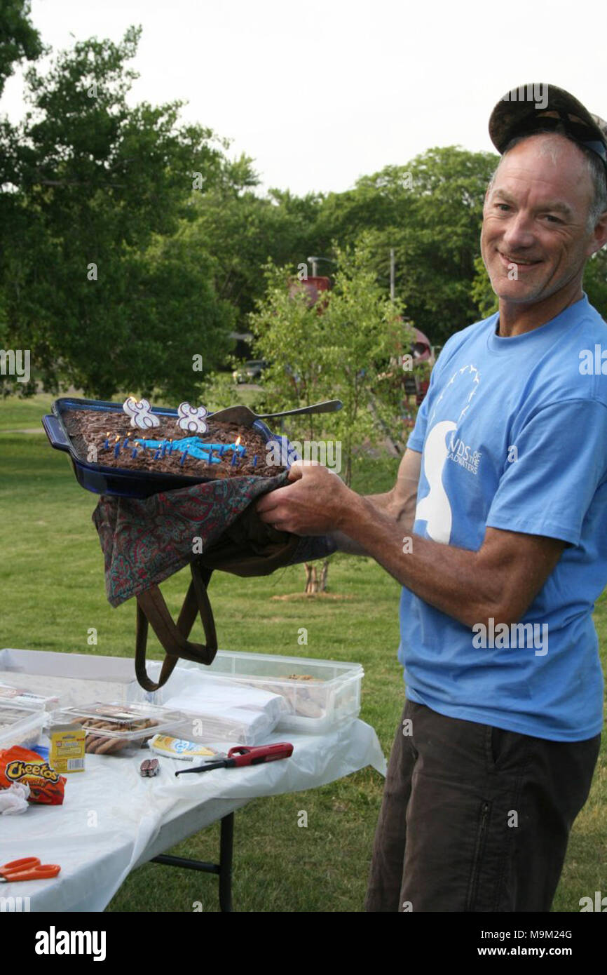 Friends of the Refuge Headwaters President Todd Paddock presents a blue ...