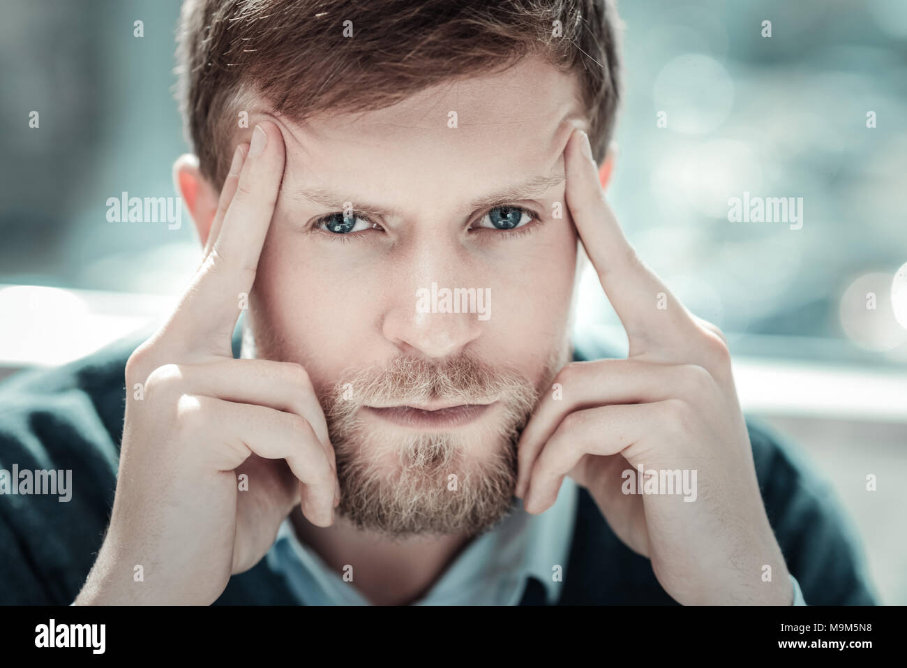 Deep concentrated man sitting and thinking Stock Photo - Alamy
