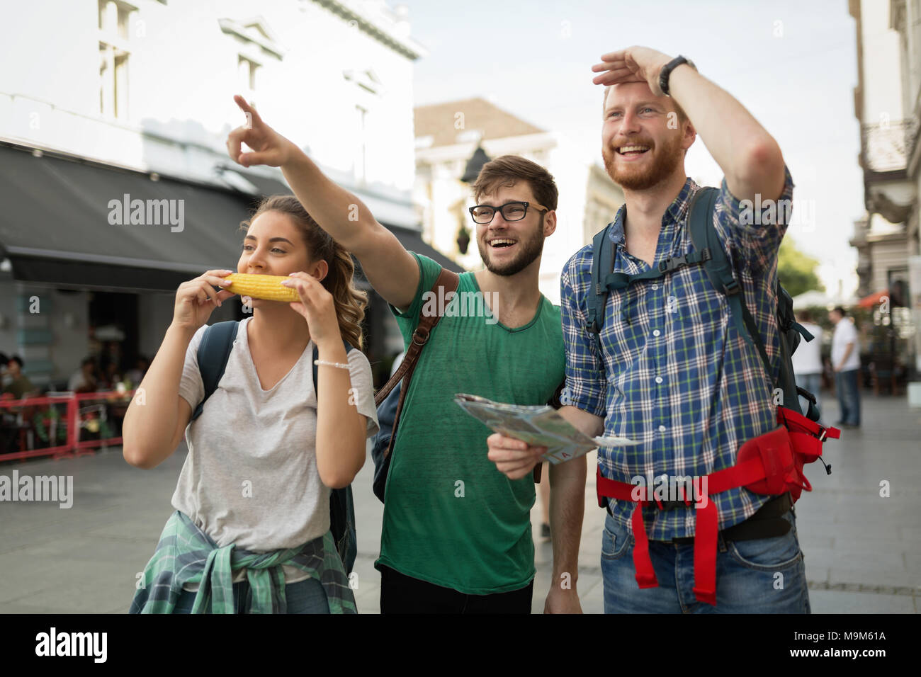 Happy group of tourists traveling and sightseeing Stock Photo - Alamy