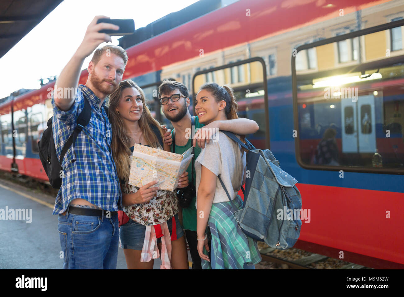 Young group of travelling tourists Stock Photo - Alamy
